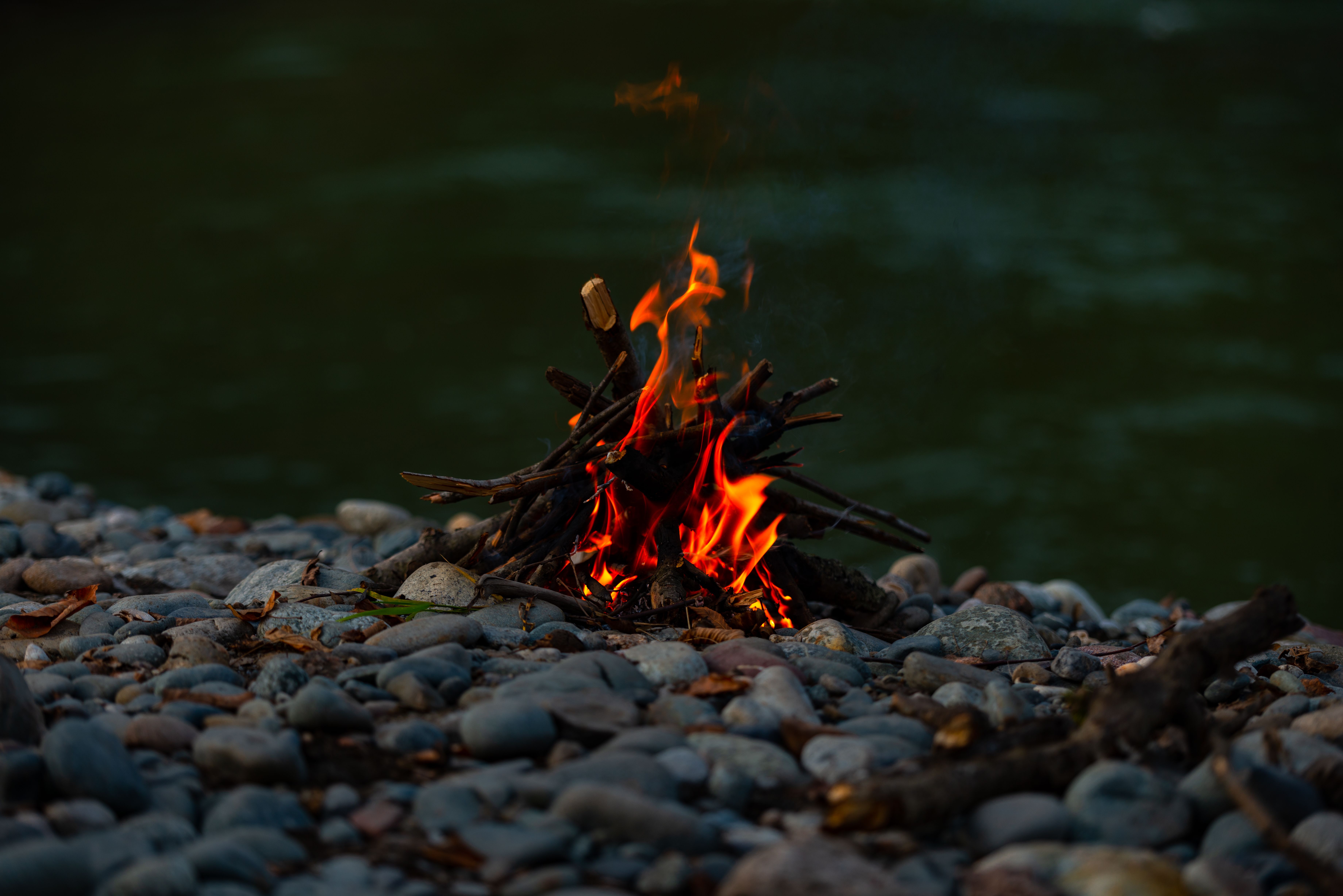 Burning Woods and Twigs on Gray Rocks · Free Stock Photo