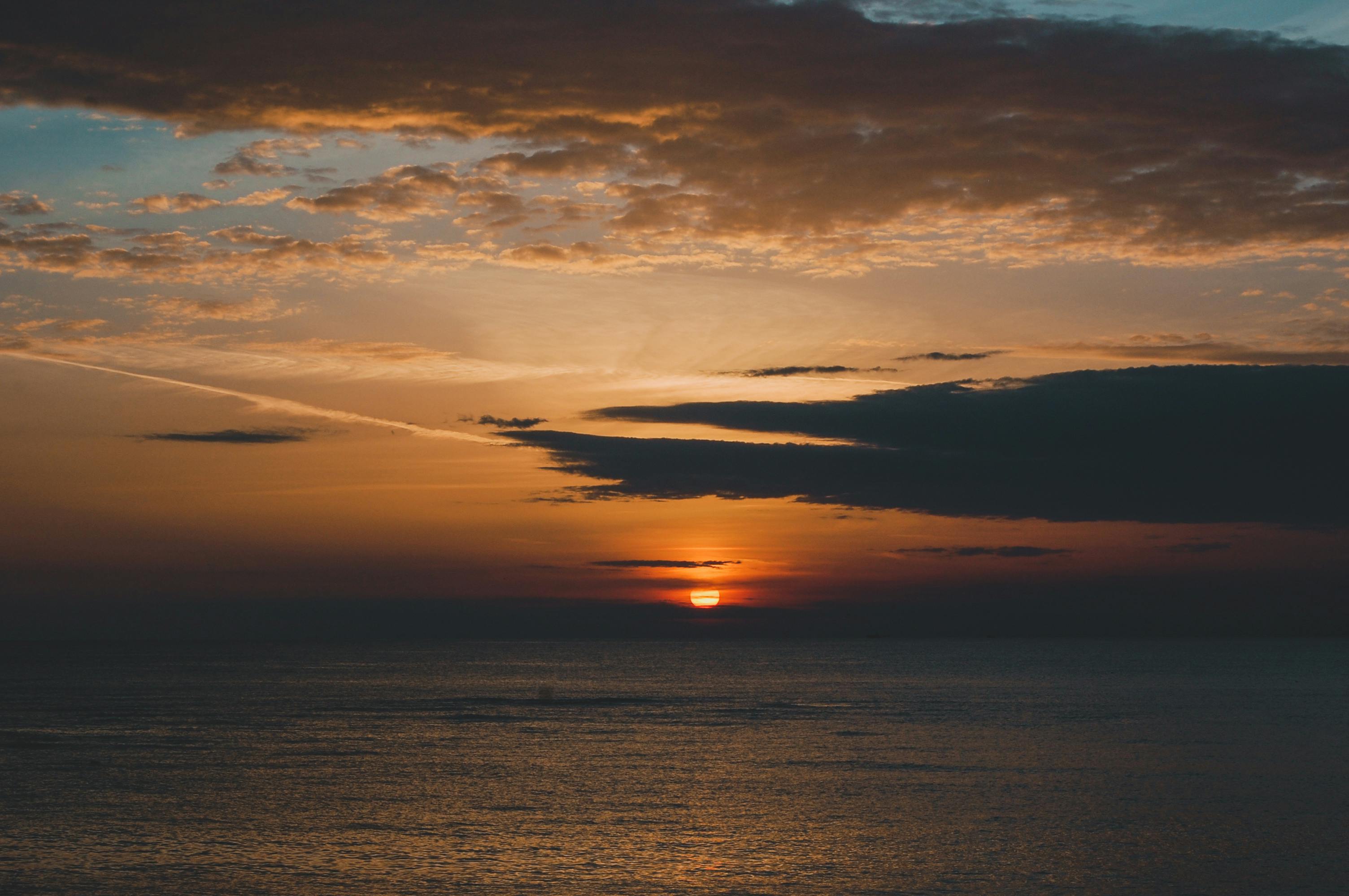 Sunset Over Body of Water · Free Stock Photo