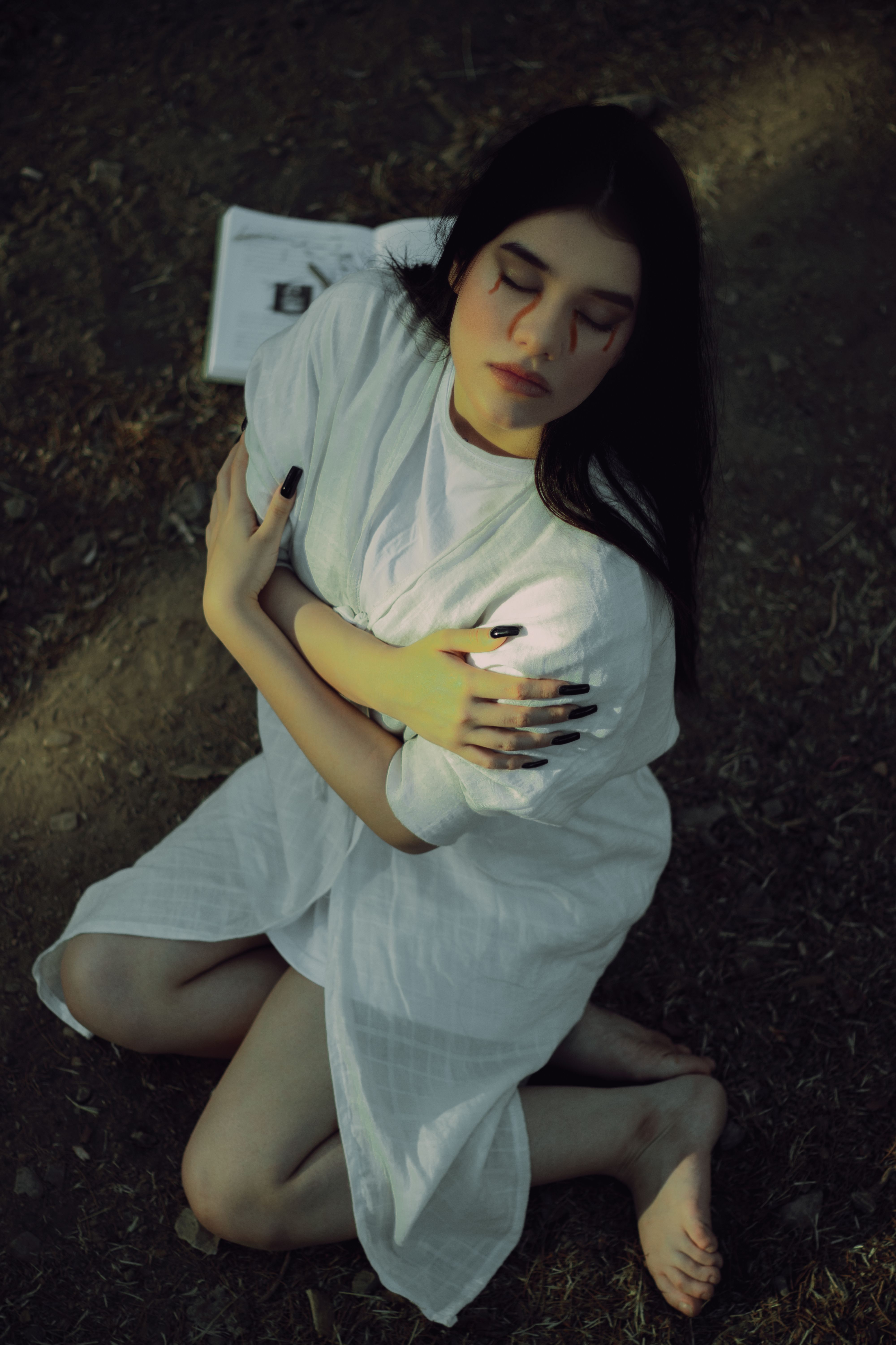 A Woman Crying Blood Hugging Herself · Free Stock Photo