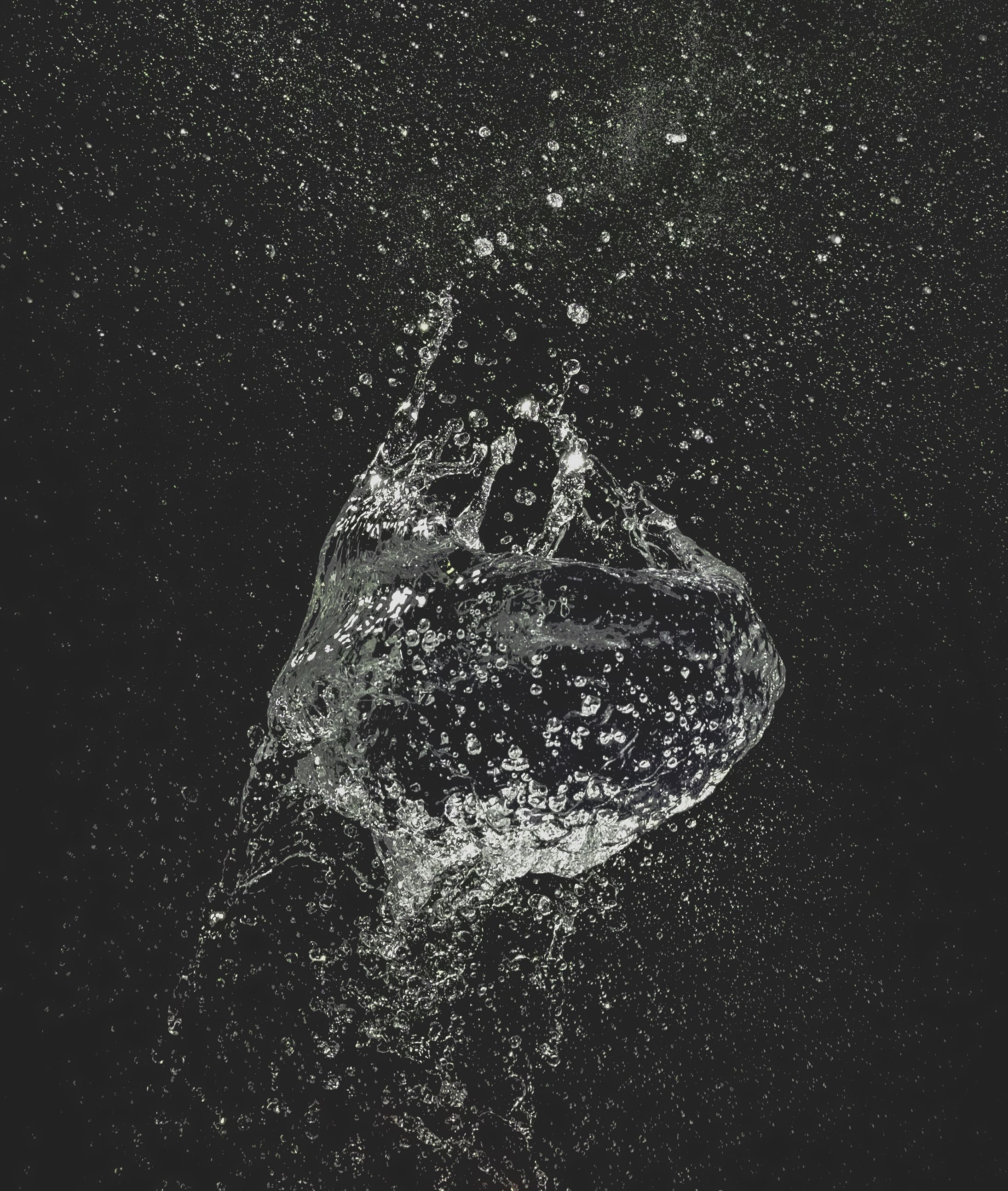 A Close-Up Shot of Water Splashing on a Rock · Free Stock Photo