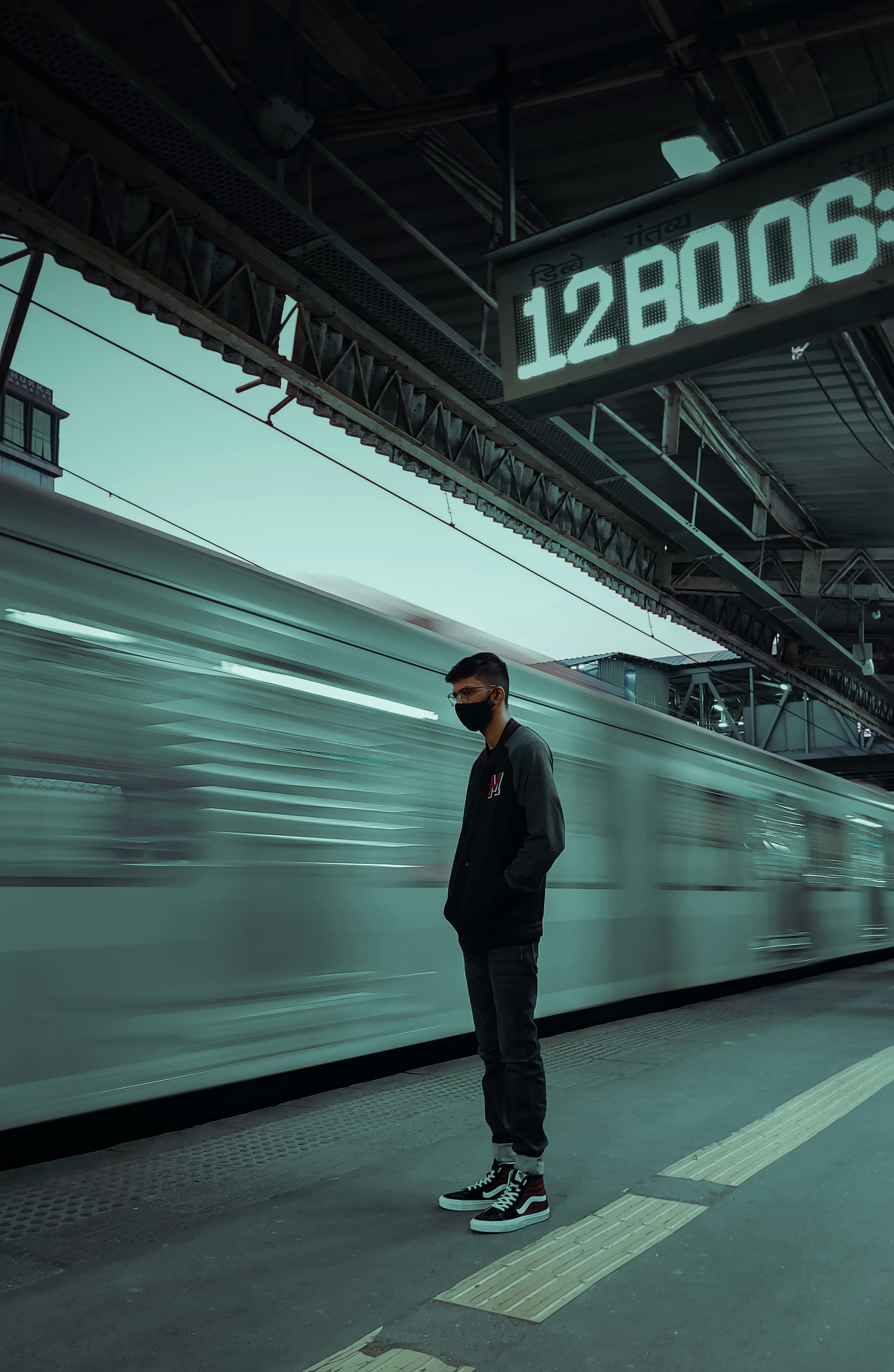 Man Standing in Train Station · Free Stock Photo