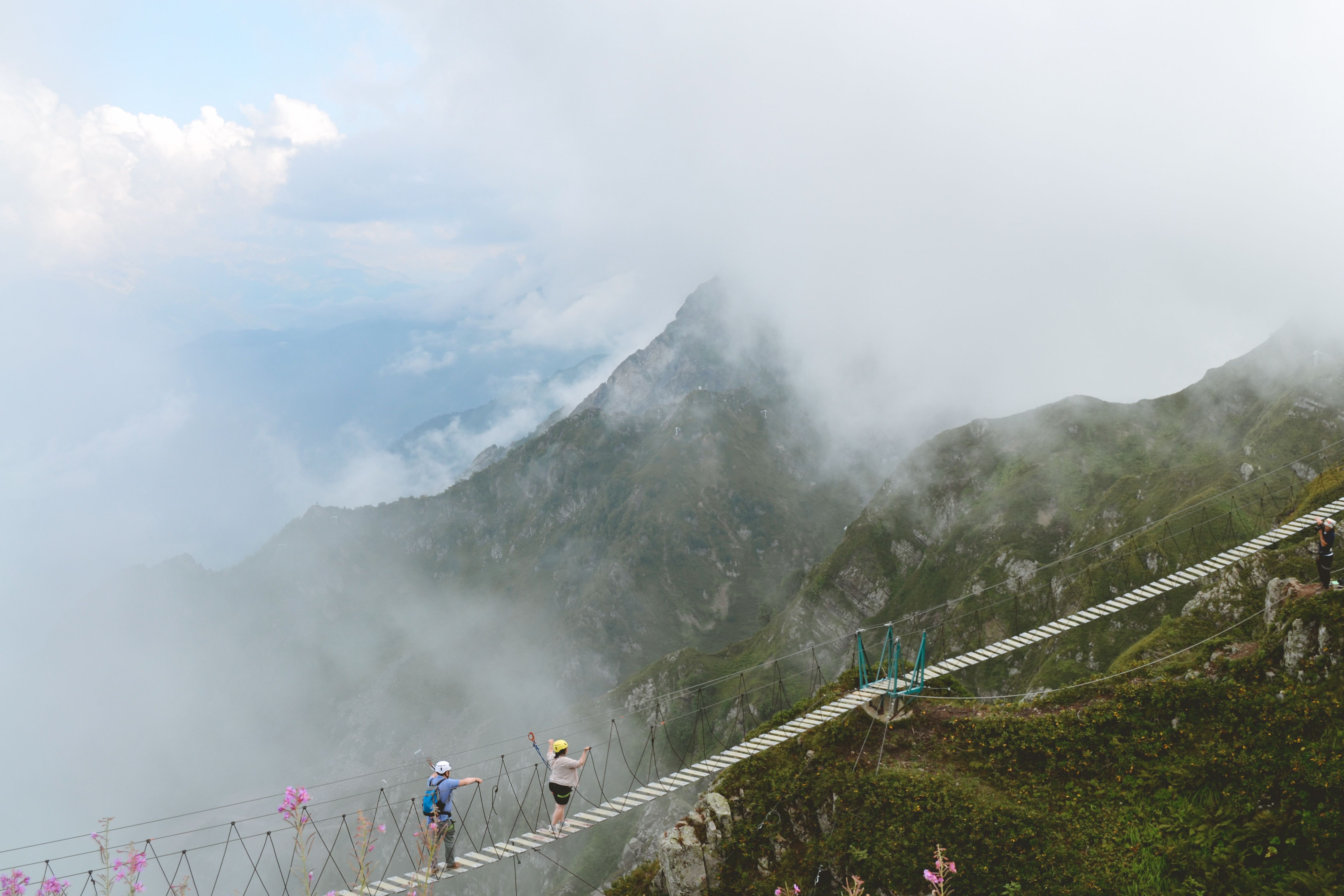 People Walking on Hanging Bridge in the Mountain · Free Stock Photo