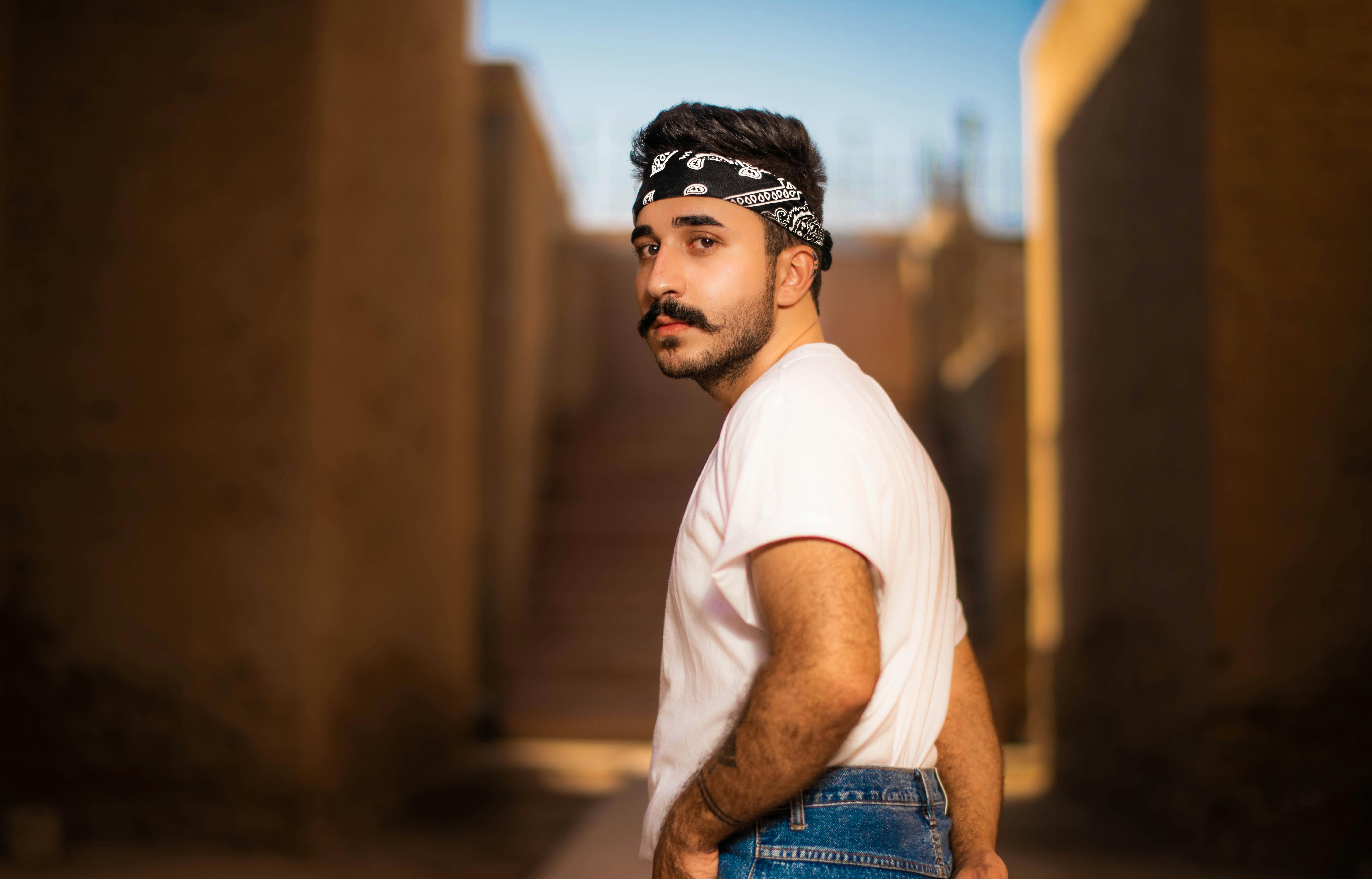 A Man Looking Over His Shoulder · Free Stock Photo