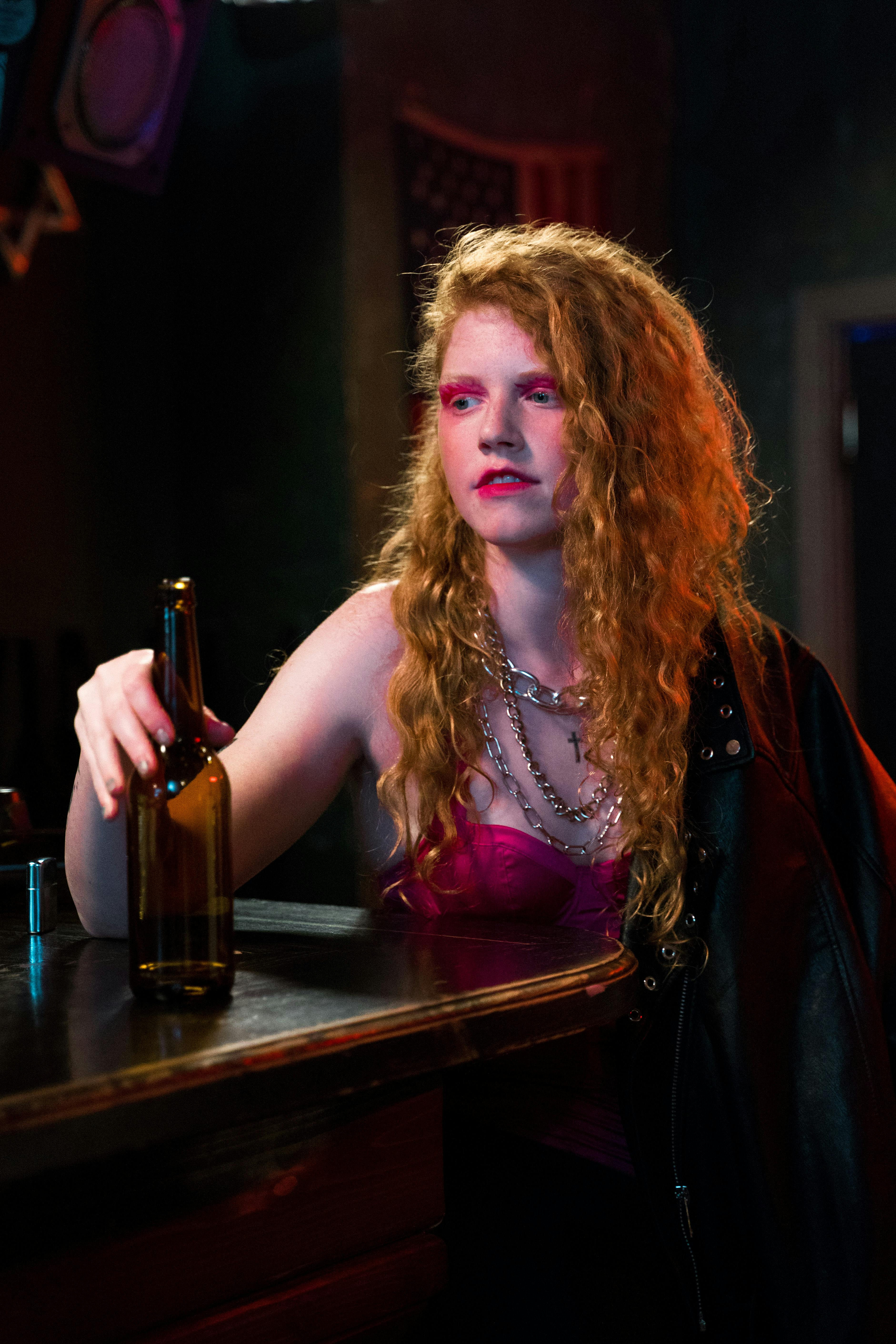 Redhead Woman at the Bar · Free Stock Photo