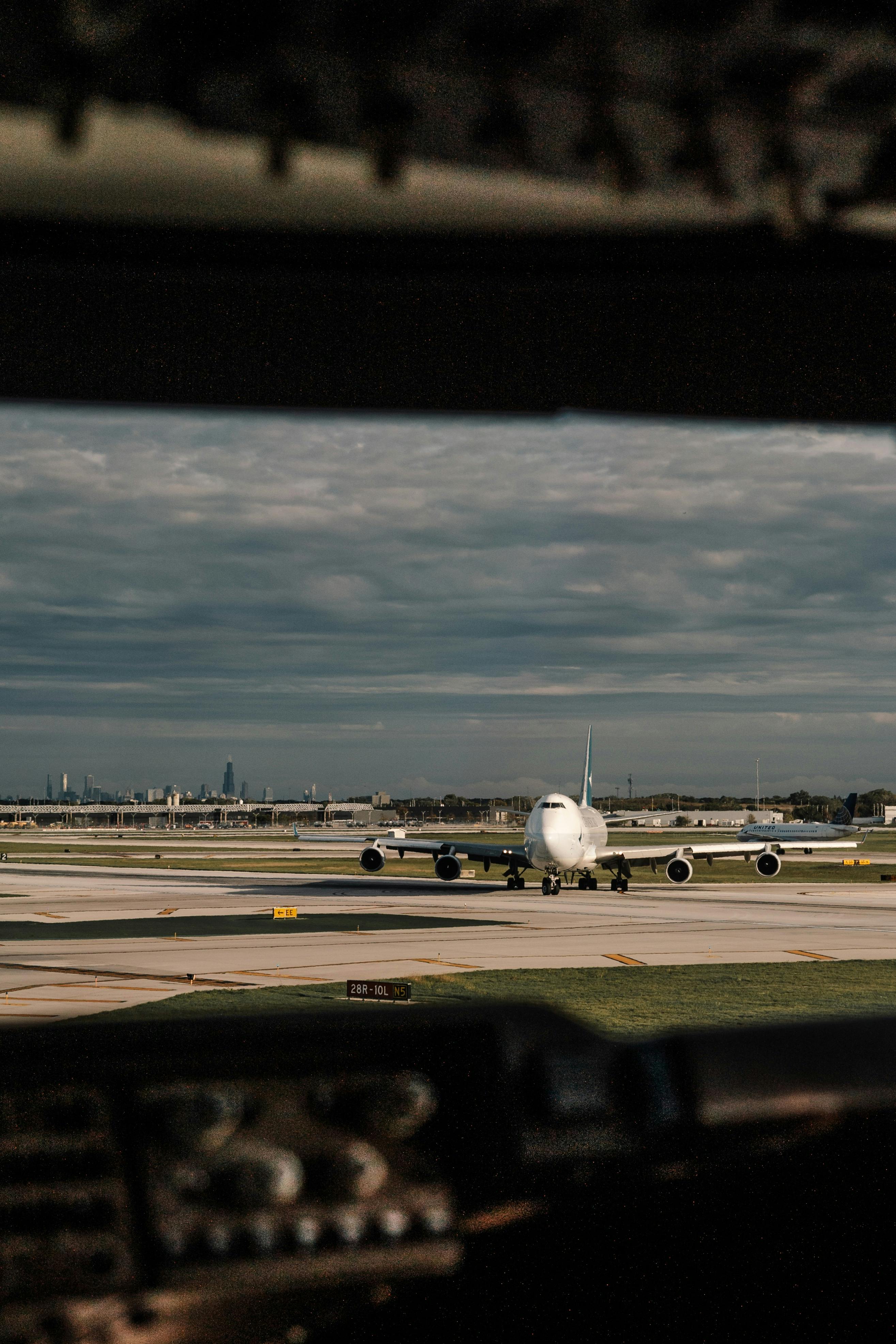 Plane on the Airport Landing Strip · Free Stock Photo