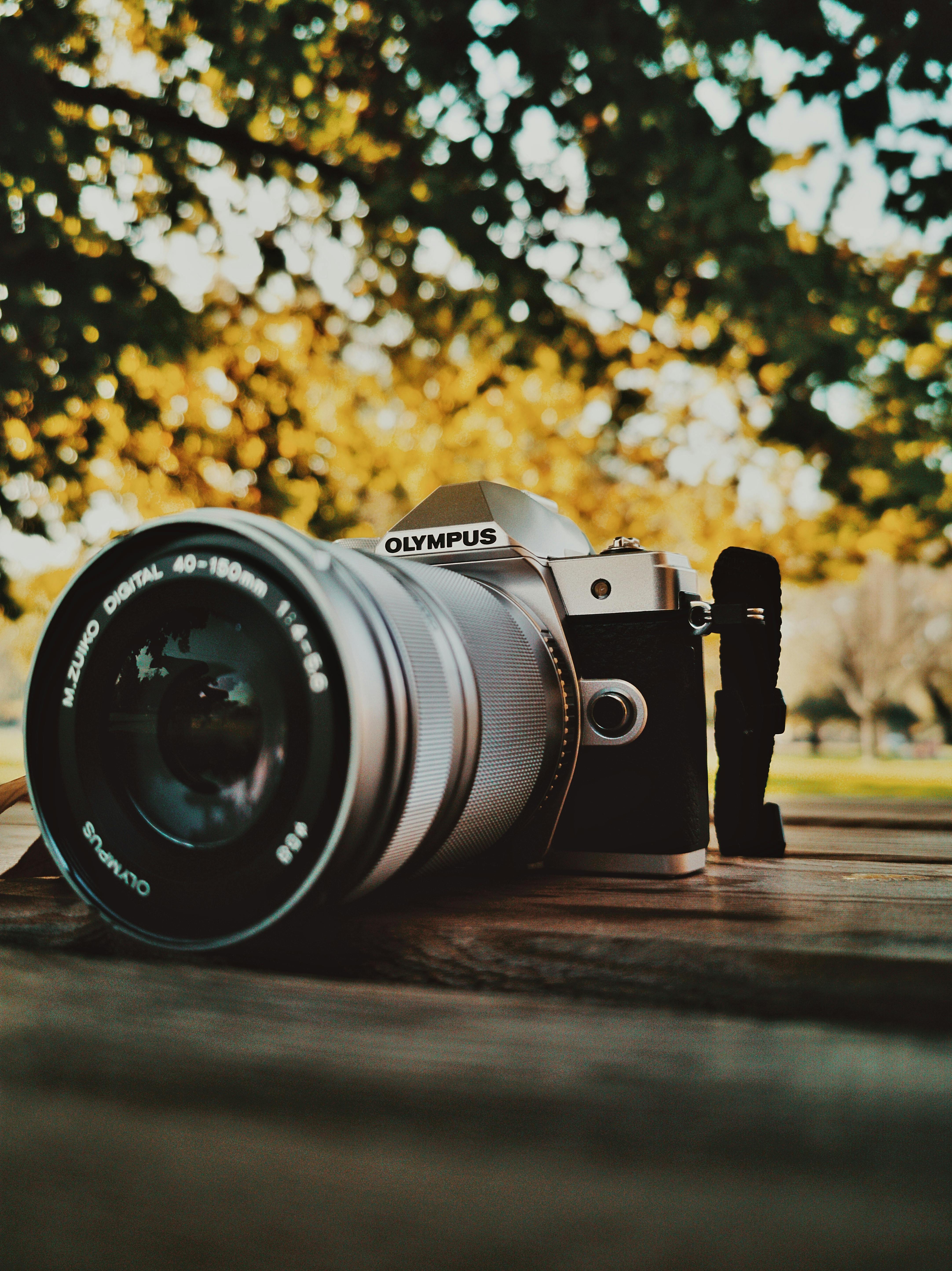 A Camera on Top of a Wooden Table · Free Stock Photo