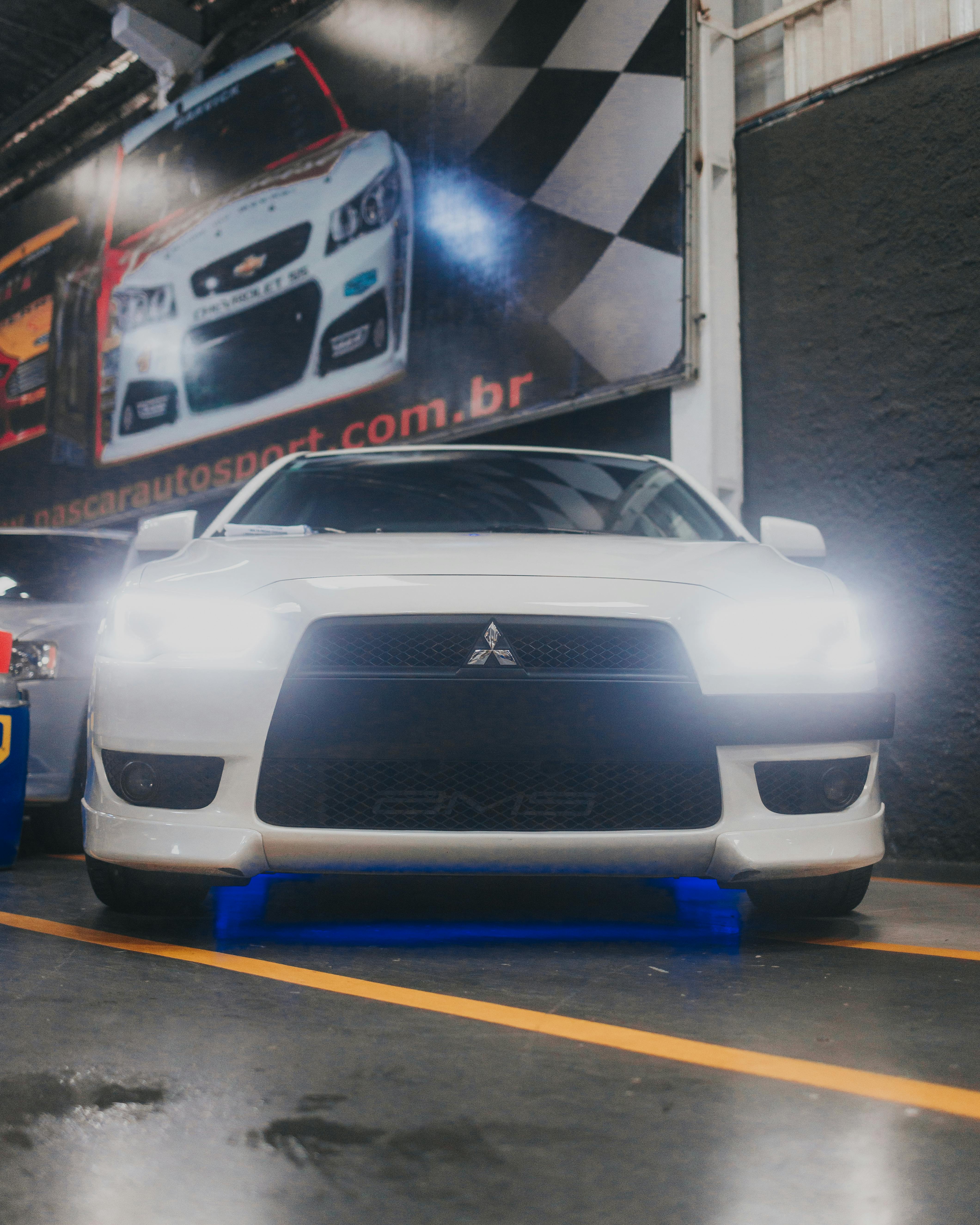 Modified Mitsubishi Lancer in a Car Dealership · Free Stock Photo