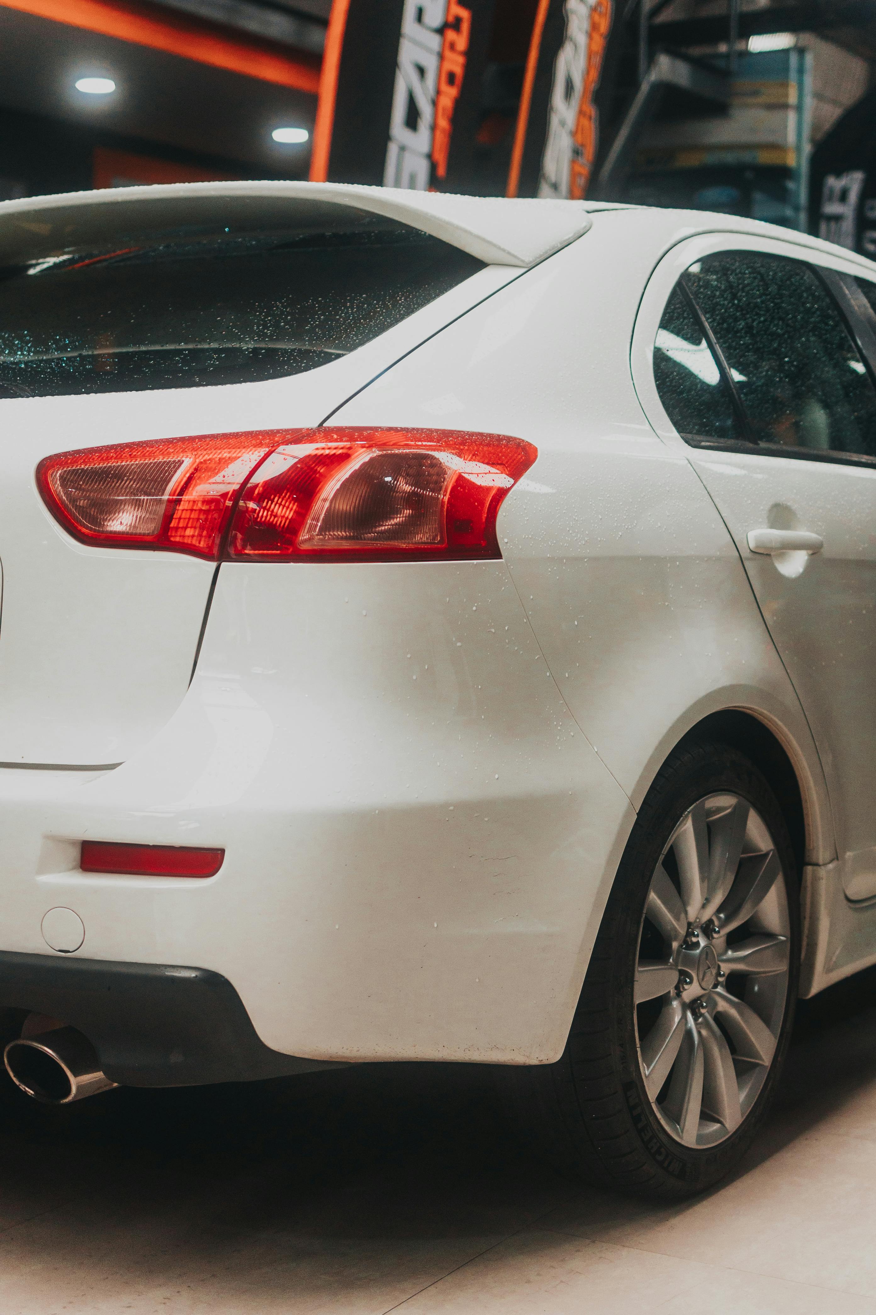 Close-Up Shot of White Car · Free Stock Photo