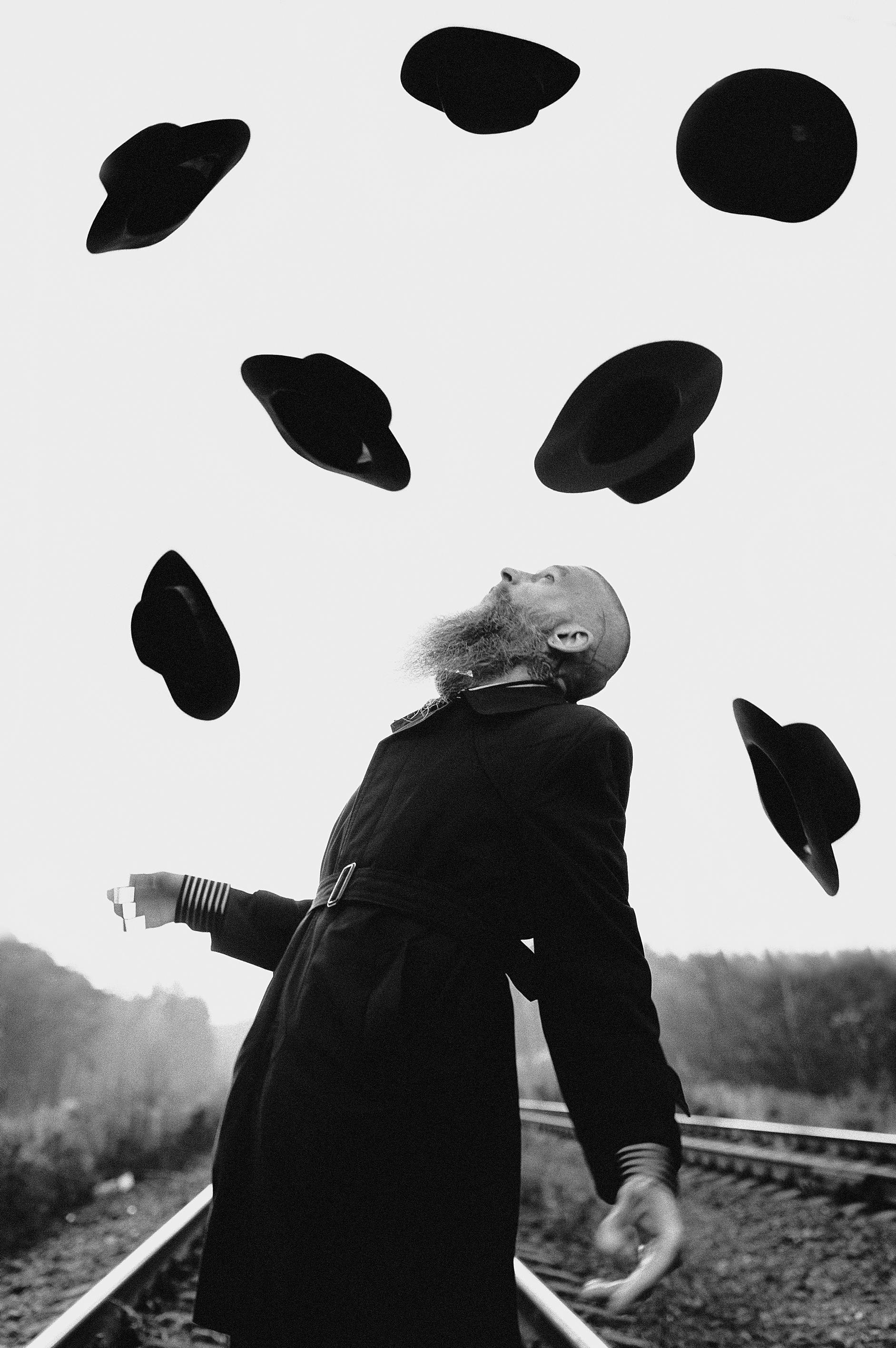 Male Magician and Floating Hats · Free Stock Photo