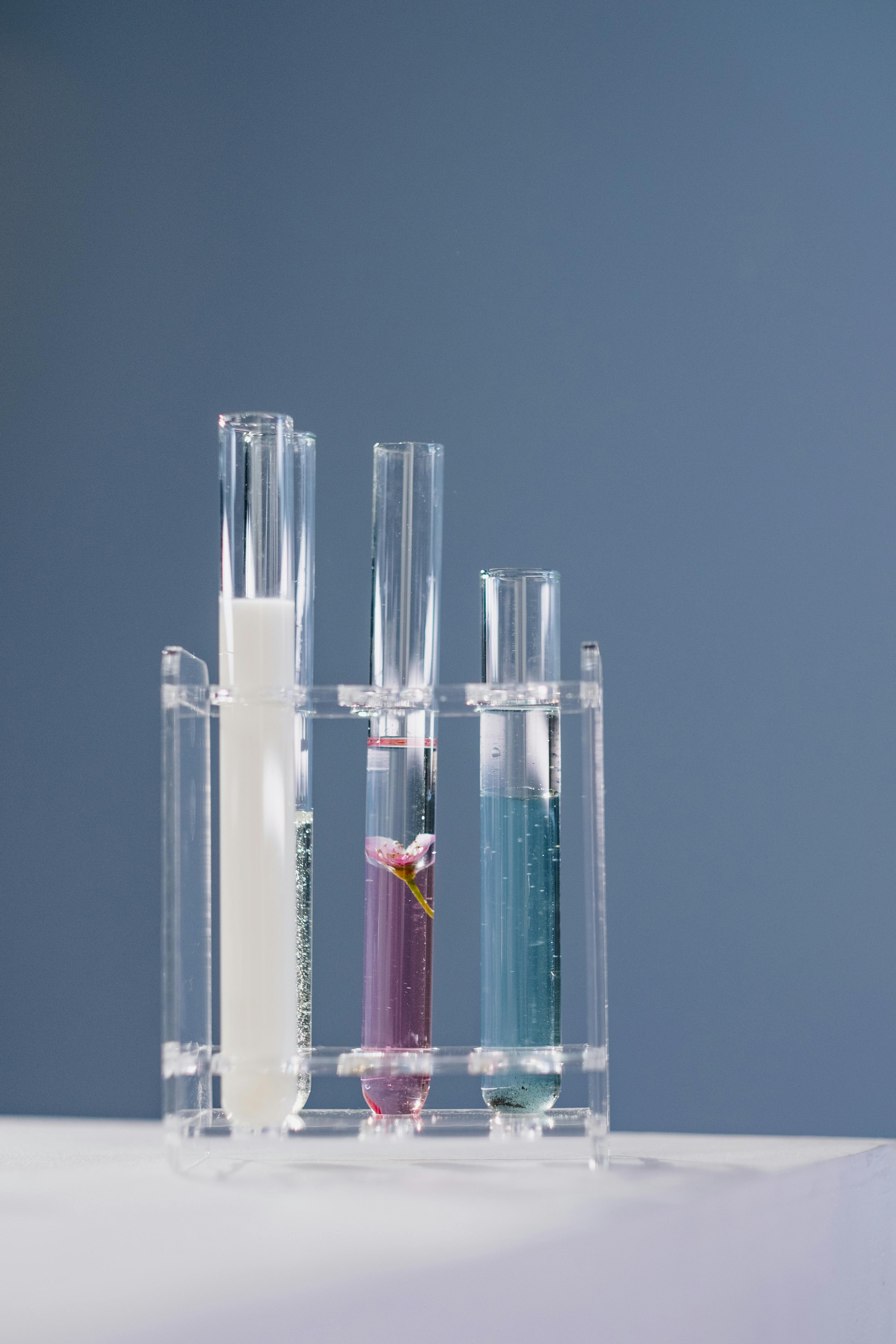 Test Tubes on Blue Background · Free Stock Photo