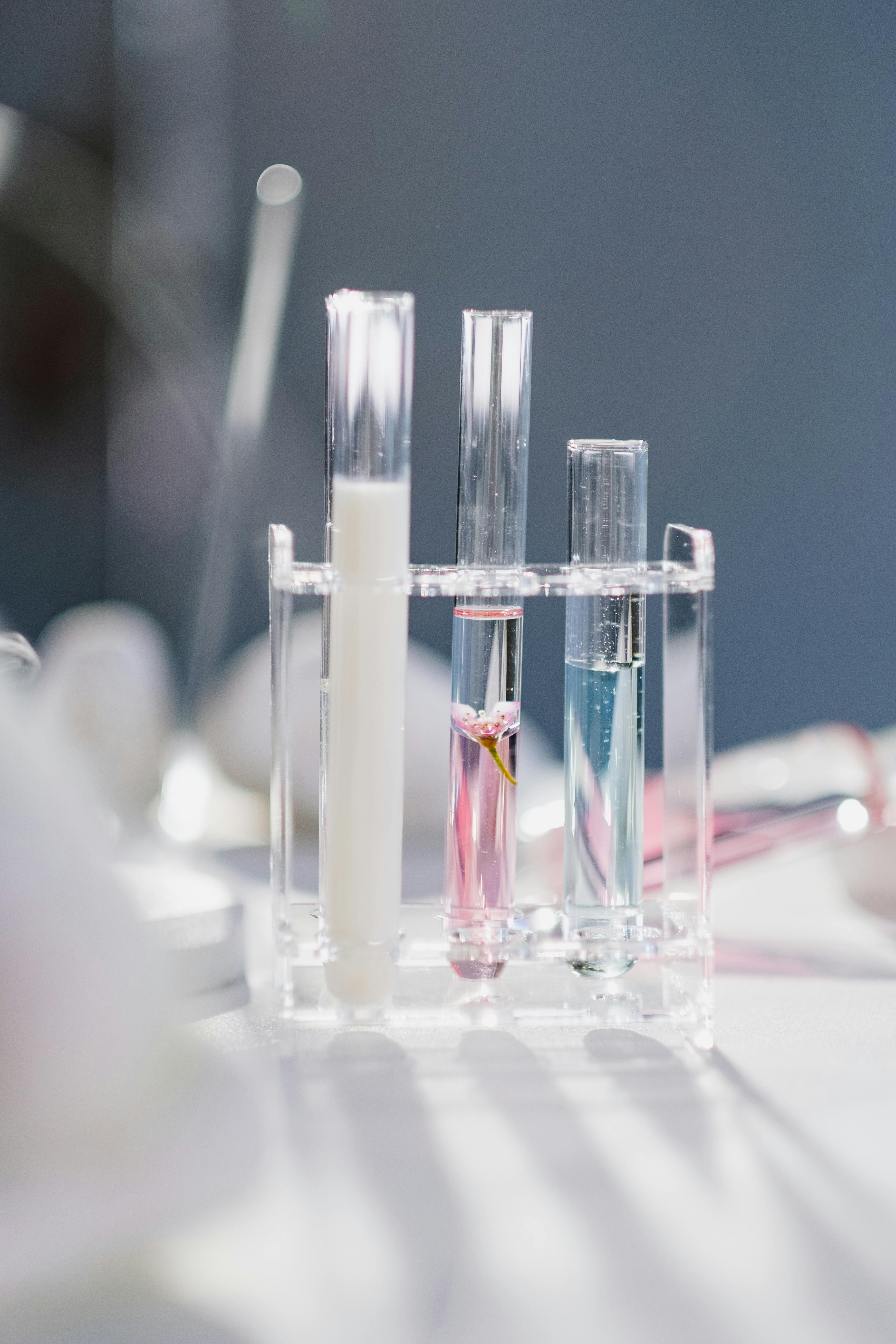 Test Tubes with Liquids on Table · Free Stock Photo