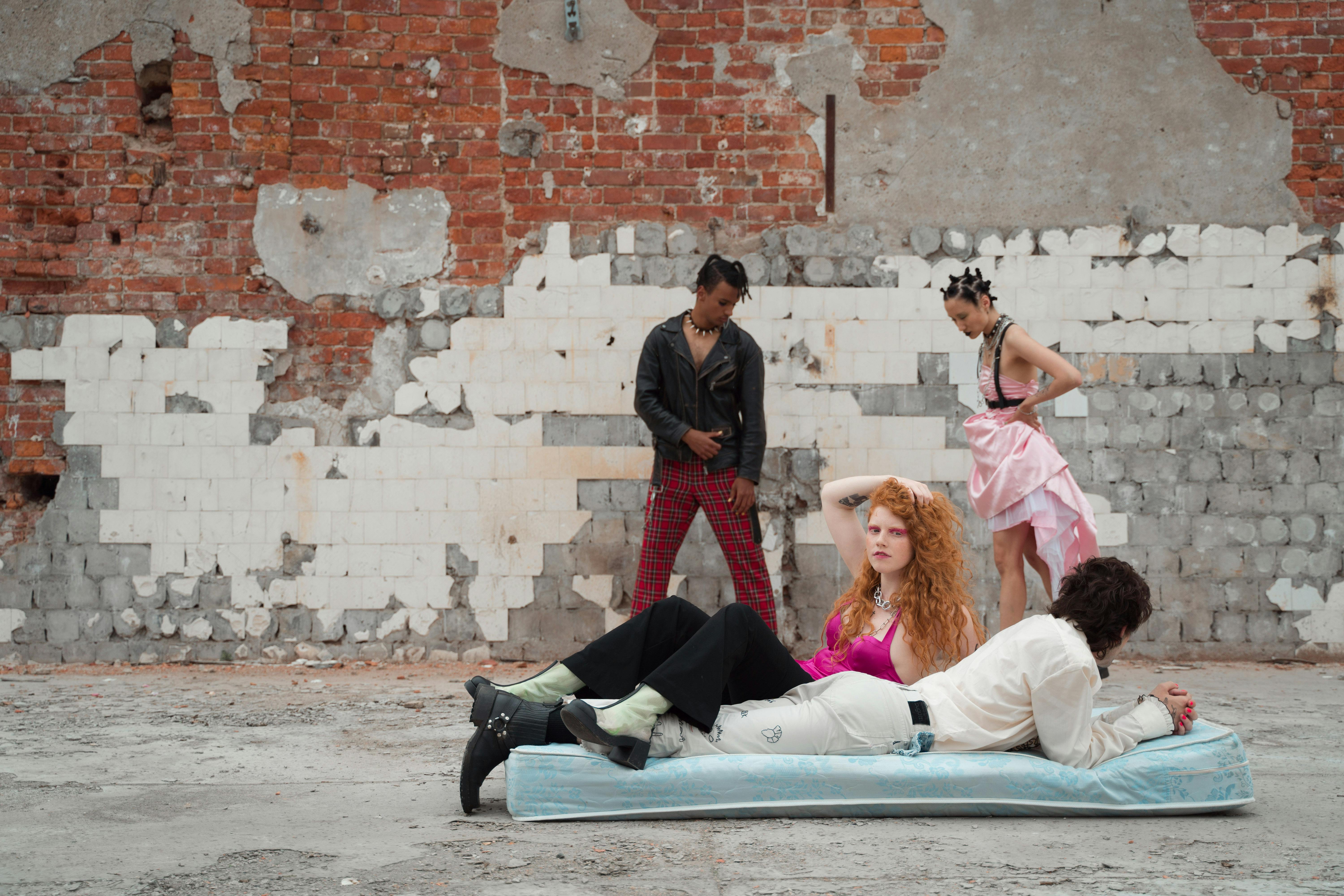 People Near the Decaying Concrete Structure with a Mattress · Free ...
