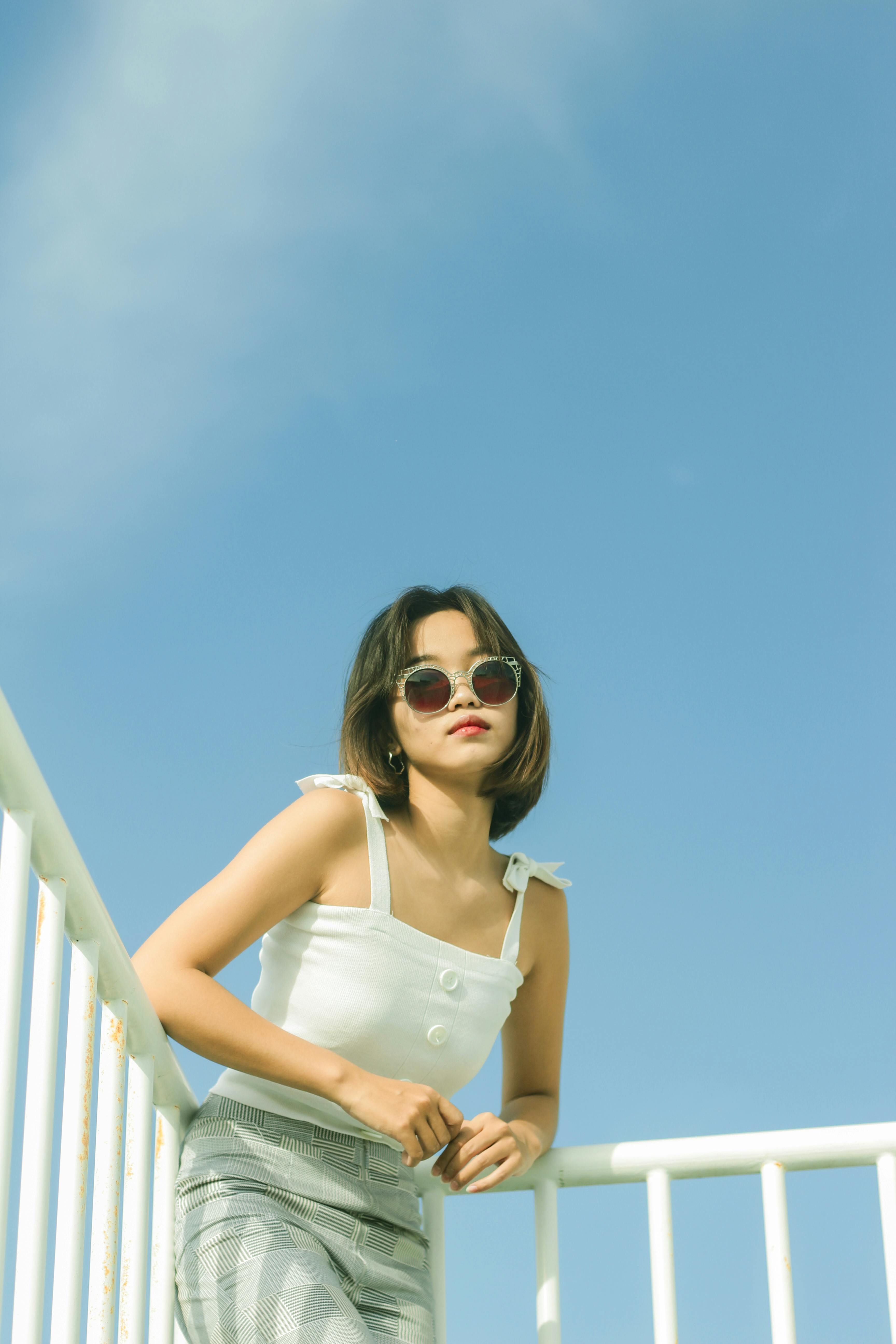 Woman Leaning on Railing · Free Stock Photo