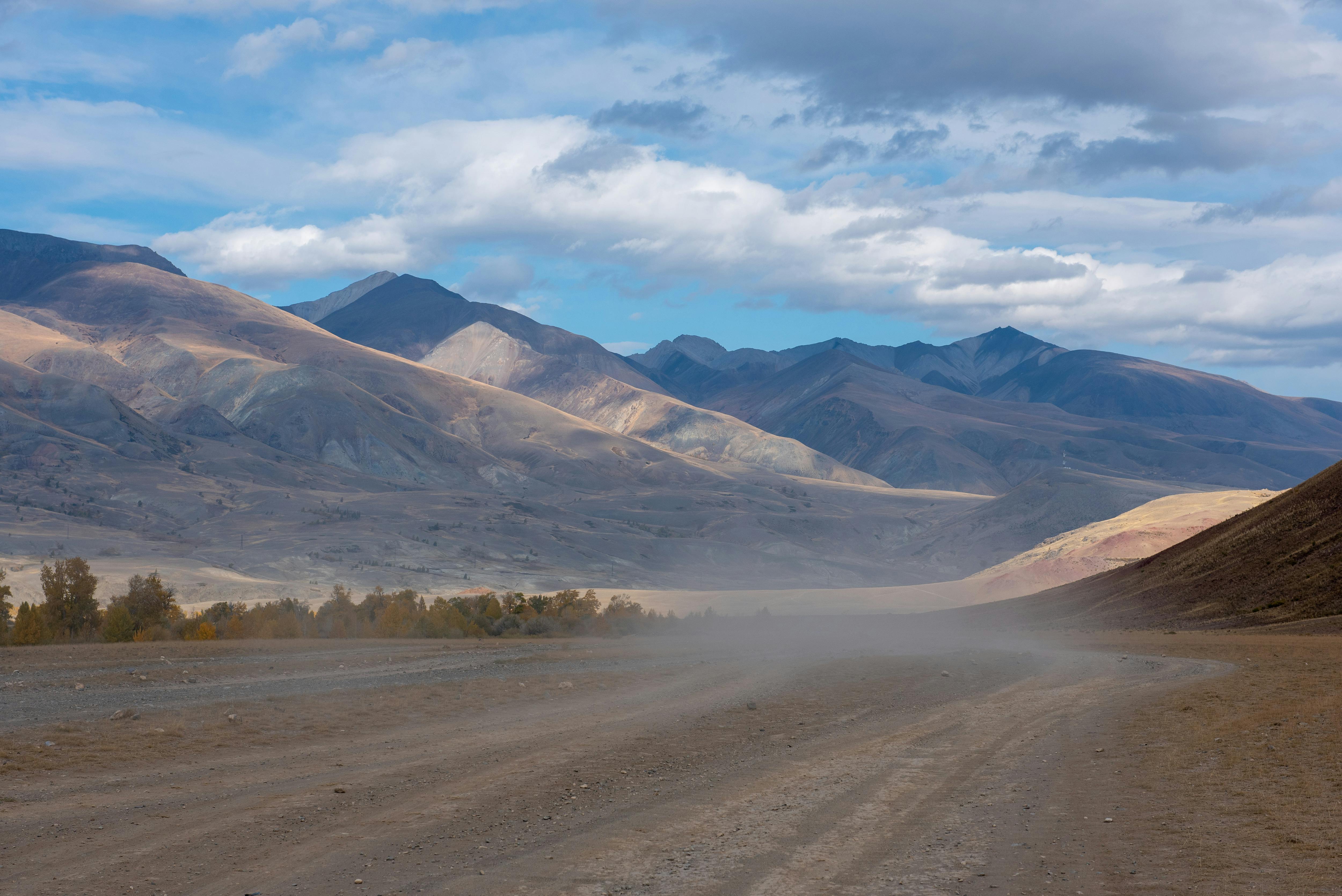 Brown Sandy Field Under Blue and White Cloudy Sky · Free Stock Photo