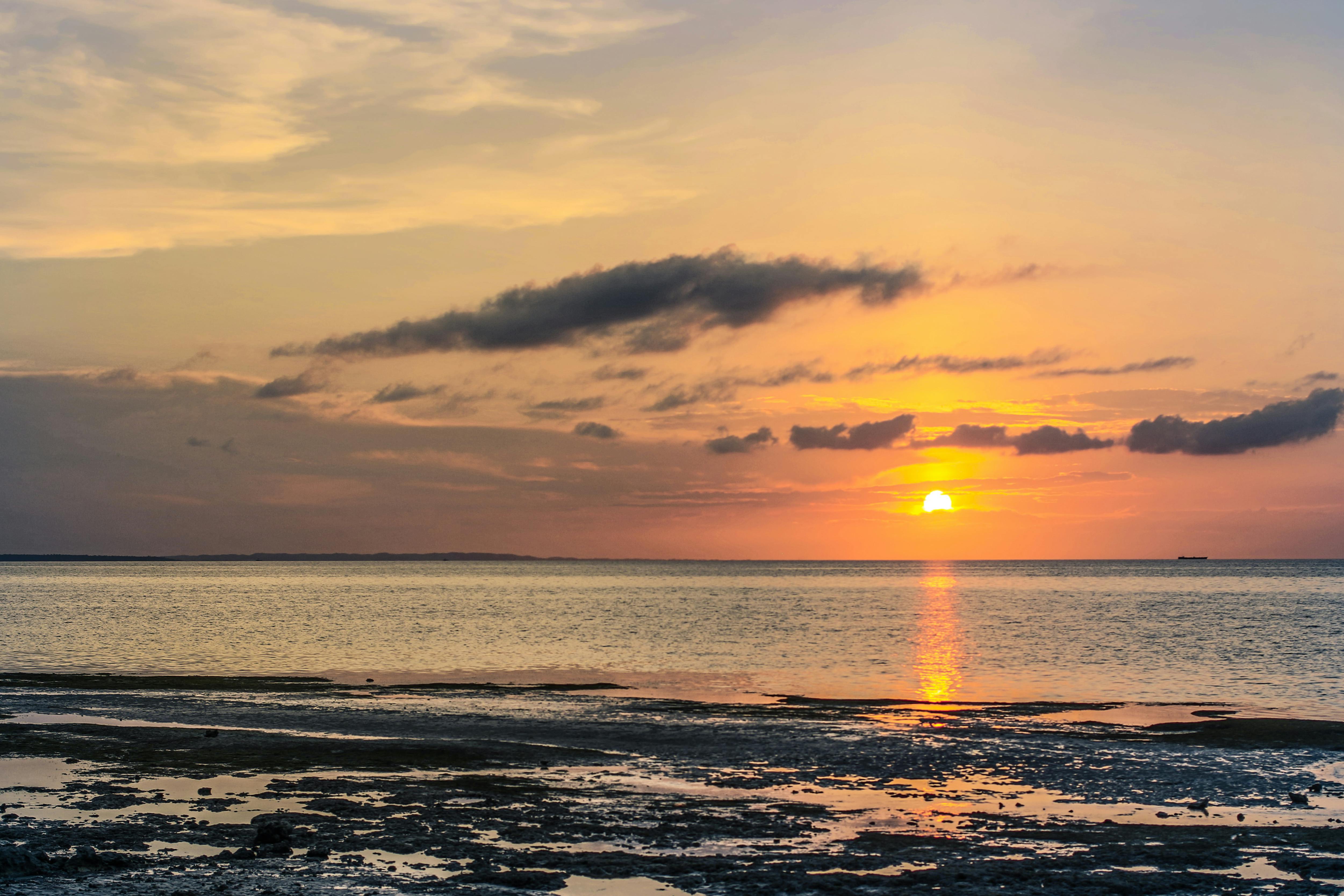Body of Water during Sunset · Free Stock Photo
