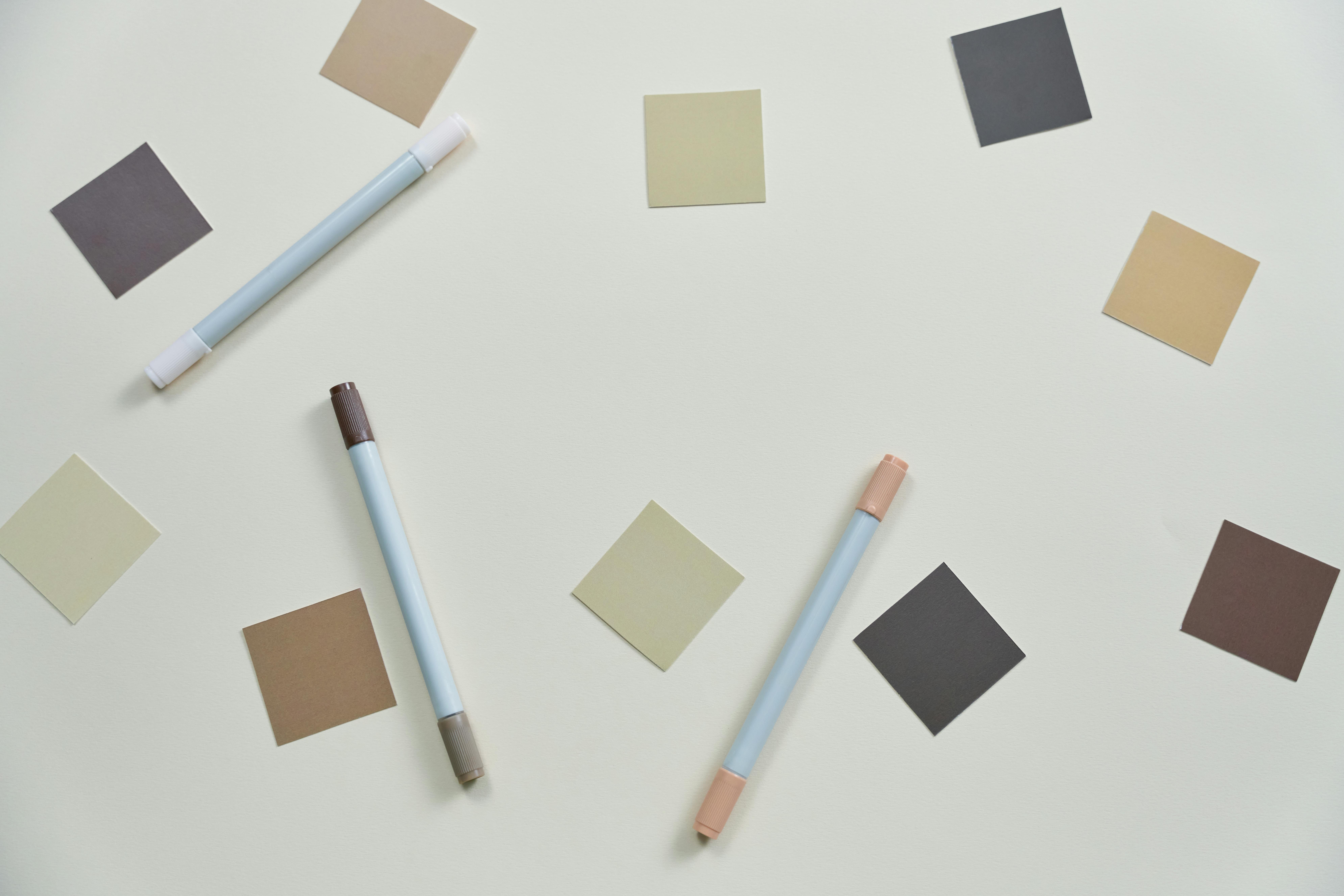 Markers and Notes on White Background · Free Stock Photo