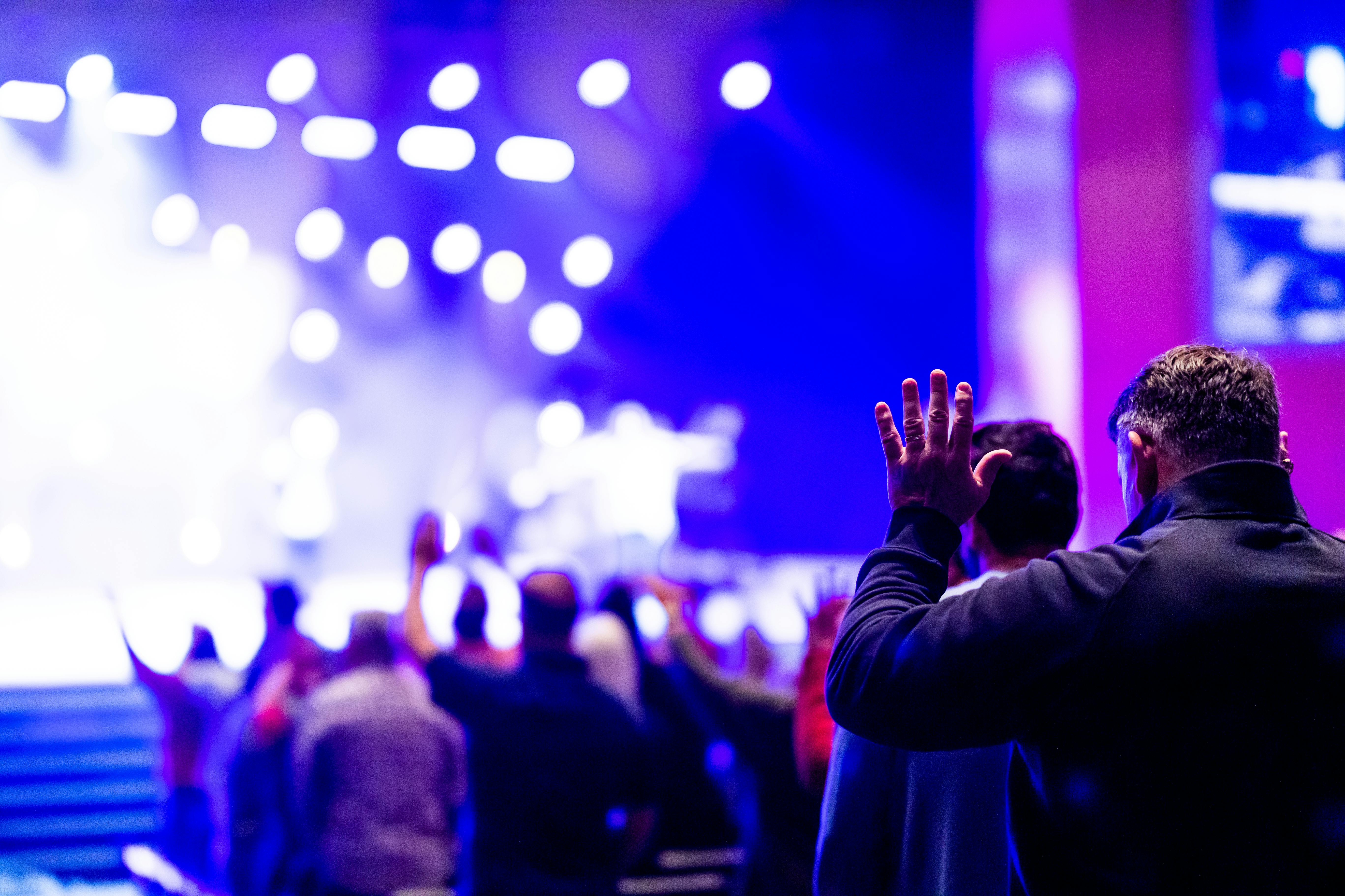 A Gathering of People raising their Hands in Prayer · Free Stock Photo