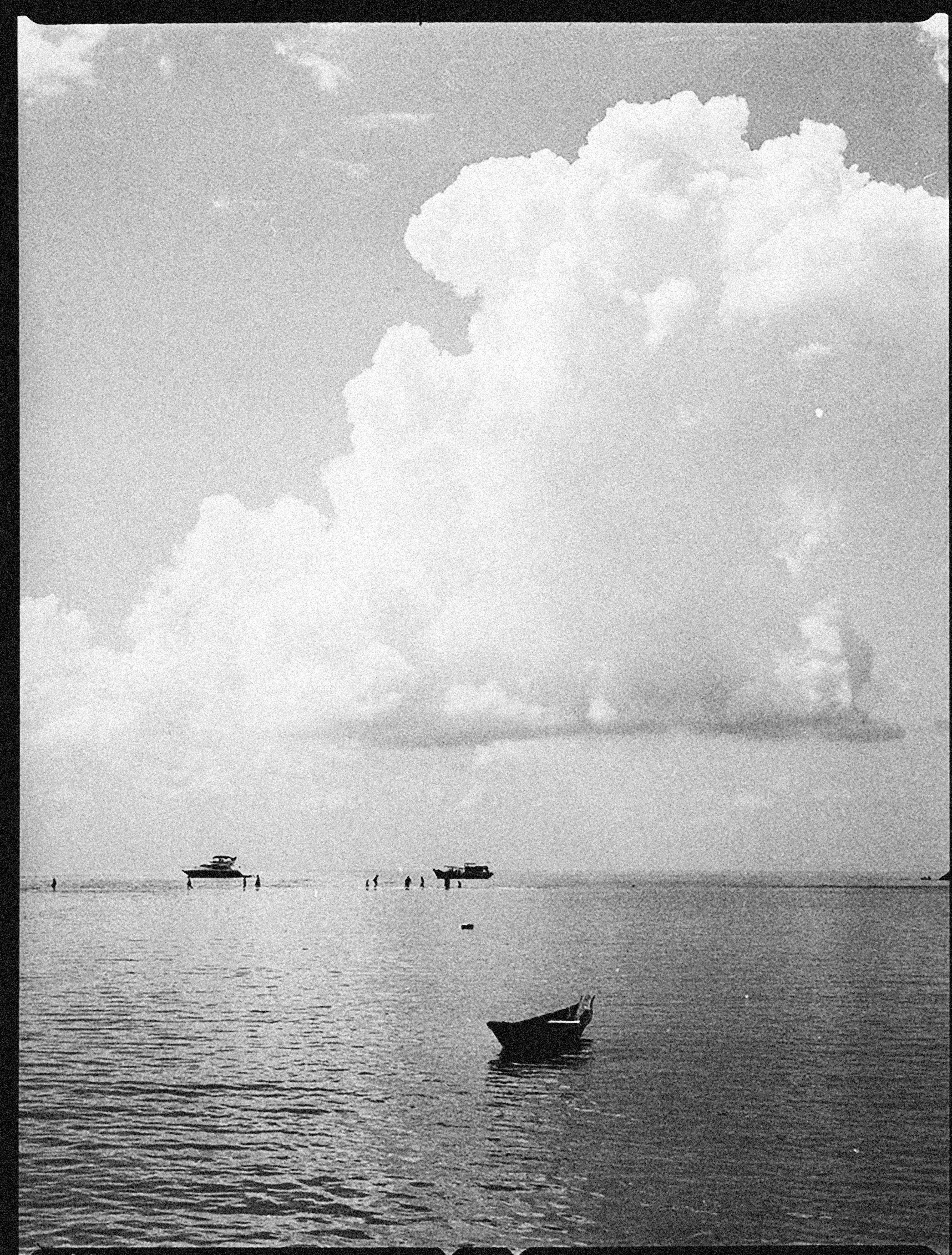 Grayscale Photo of Boat on Sea · Free Stock Photo