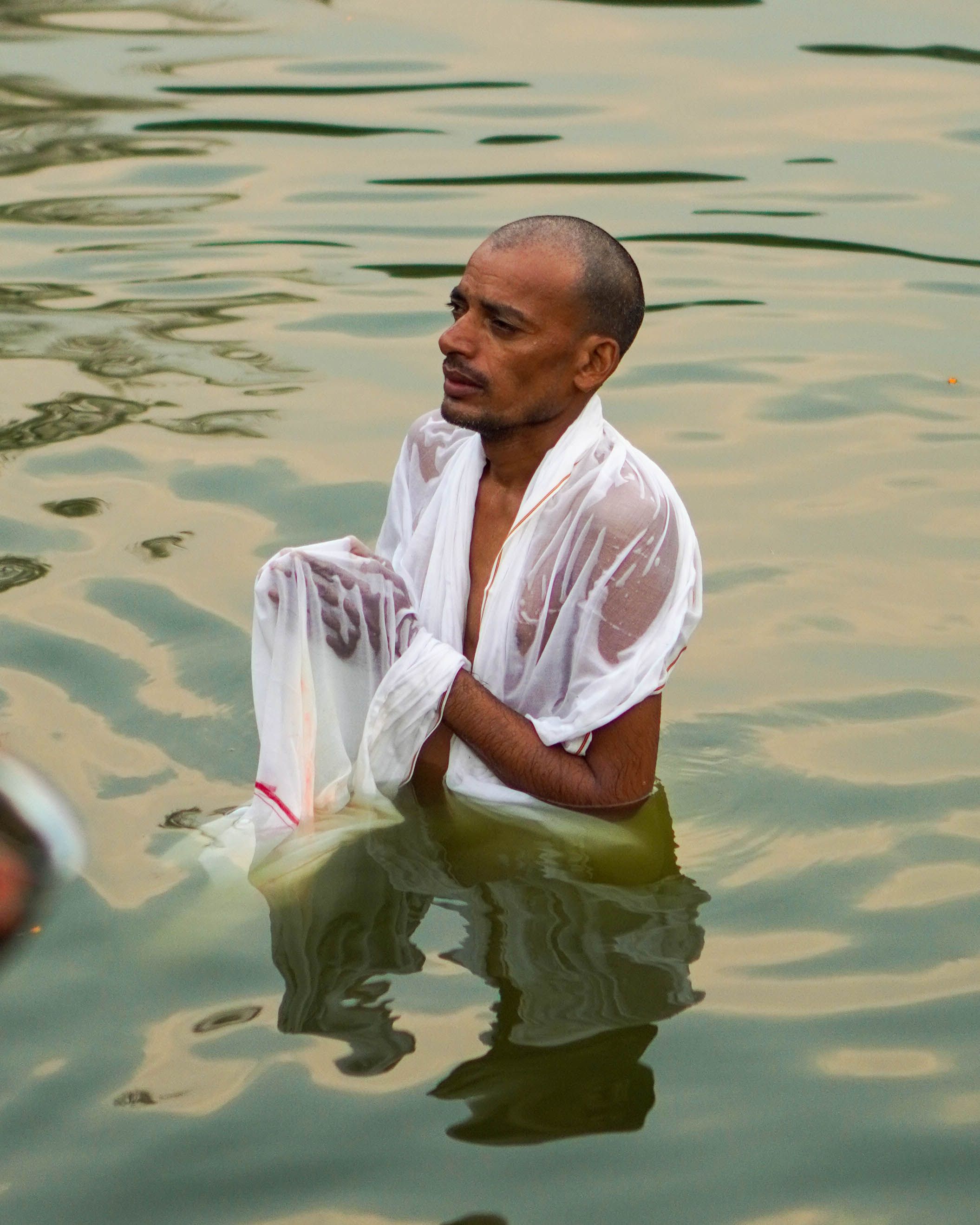 A Bald Man in White Scarf Soaking on the Water · Free Stock Photo