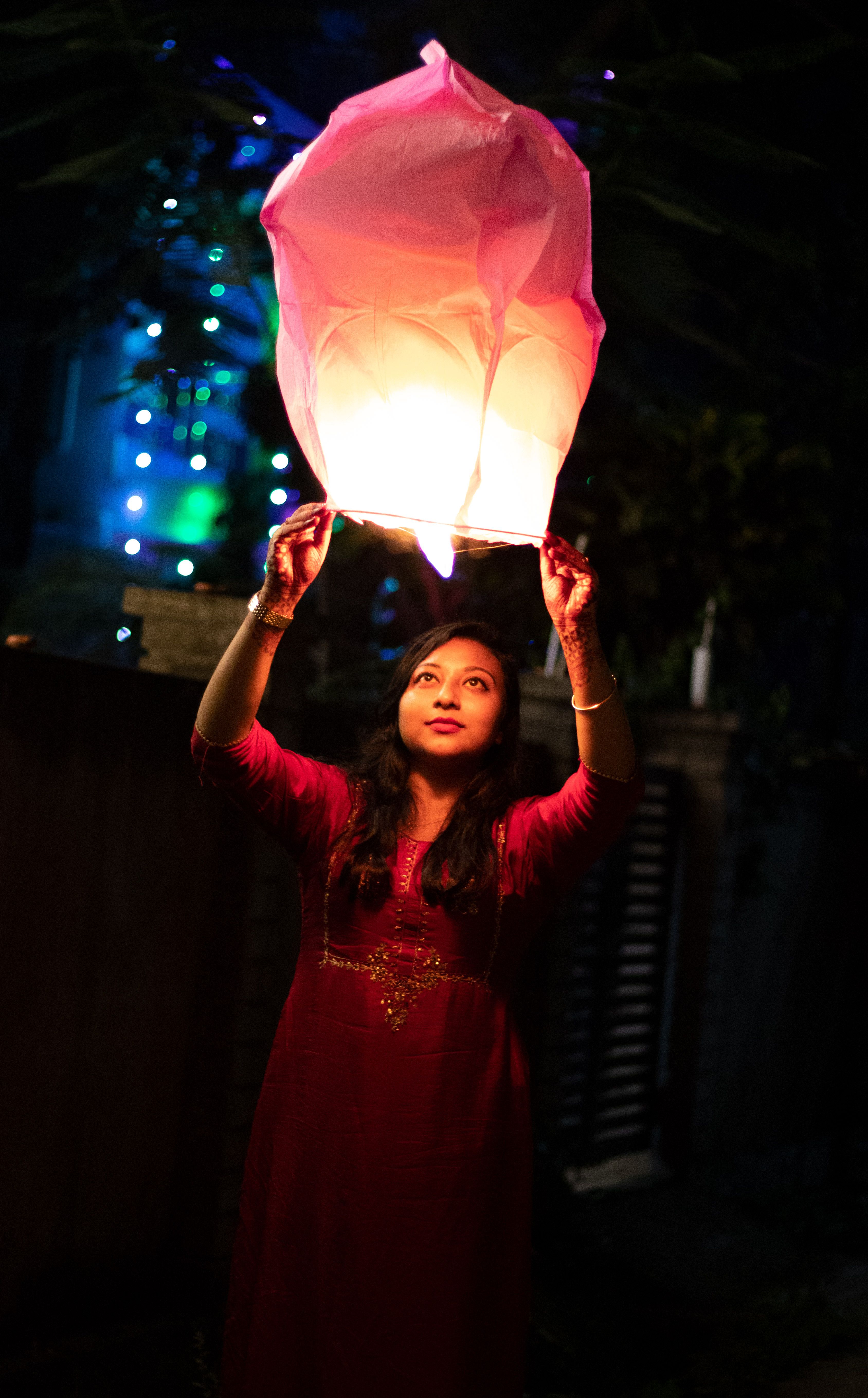 Woman in Red Dress Holding Pink Sky Lantern · Free Stock Photo