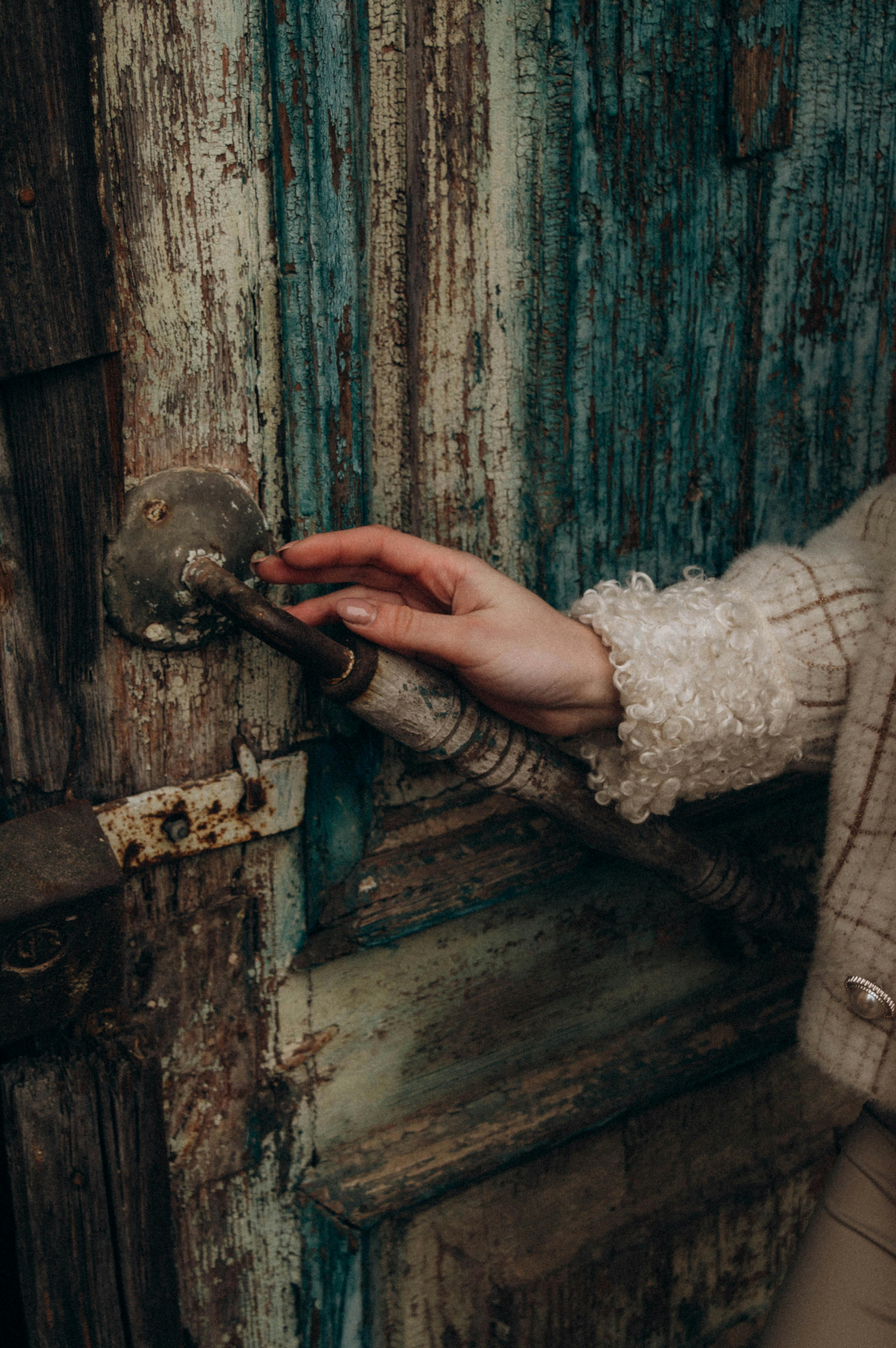 A Person Holding a Door Handle · Free Stock Photo