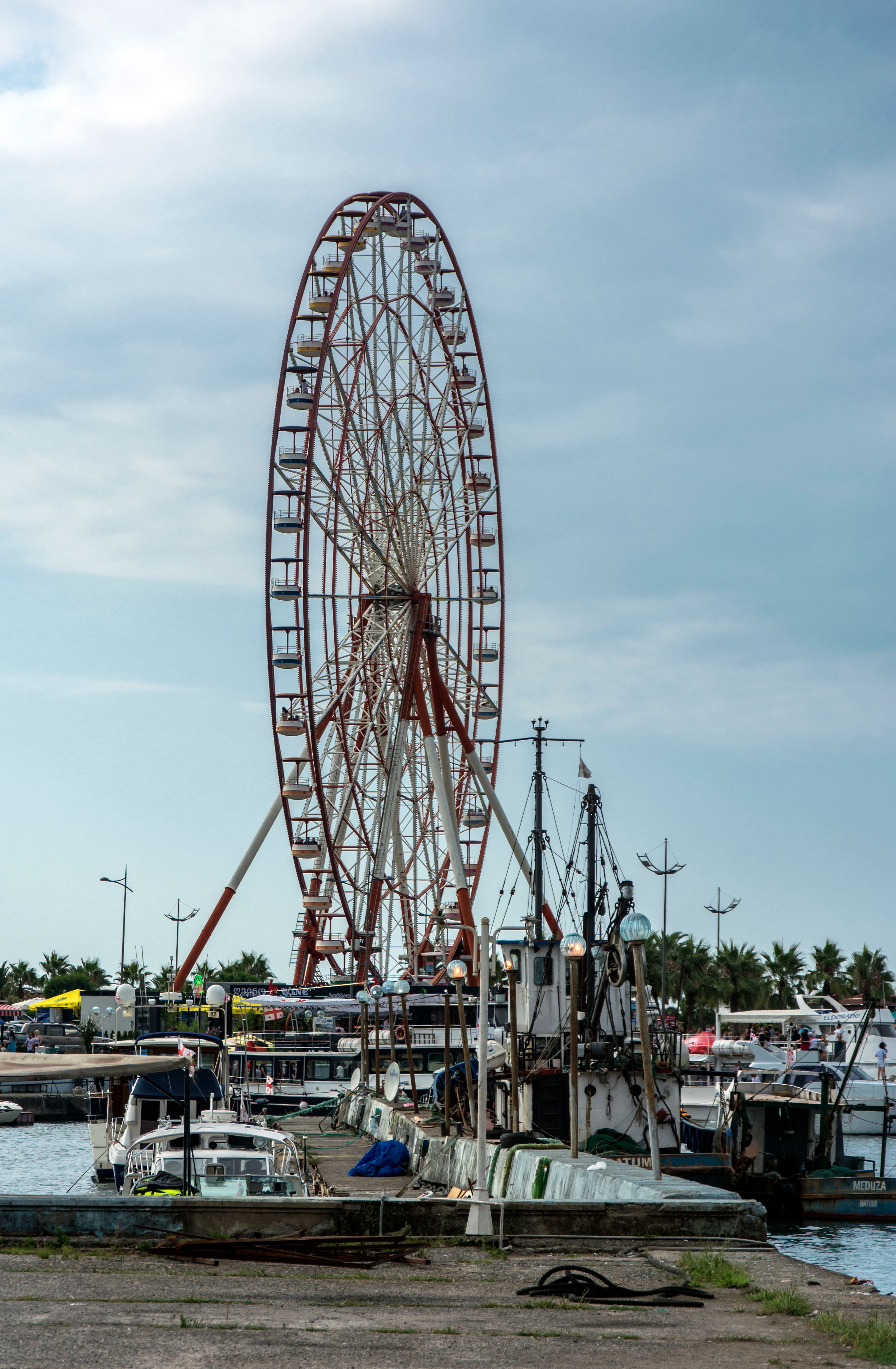 Photo of a Ferris Wheel Near Bridge · Free Stock Photo