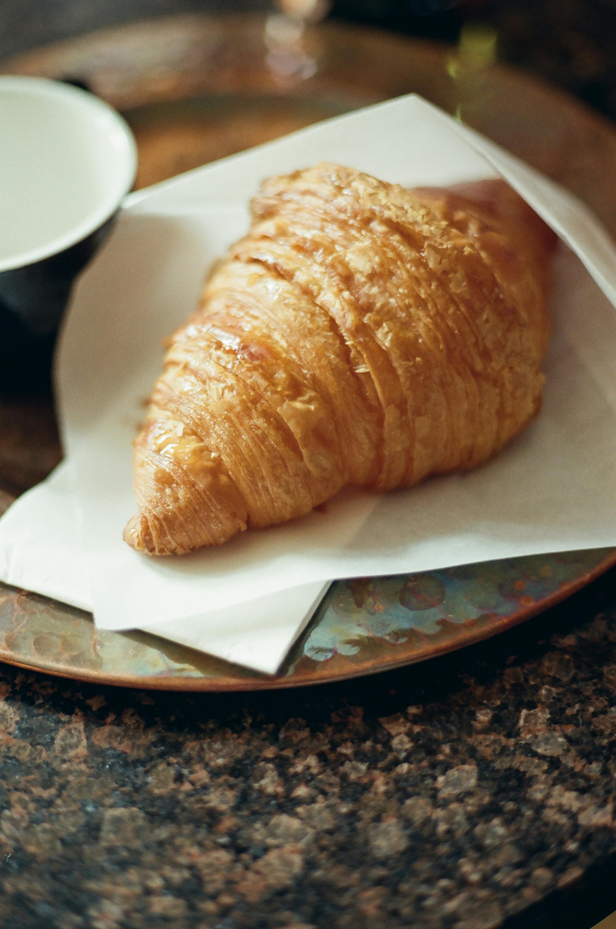 Close-Up Photograph of a Brown Croissant · Free Stock Photo