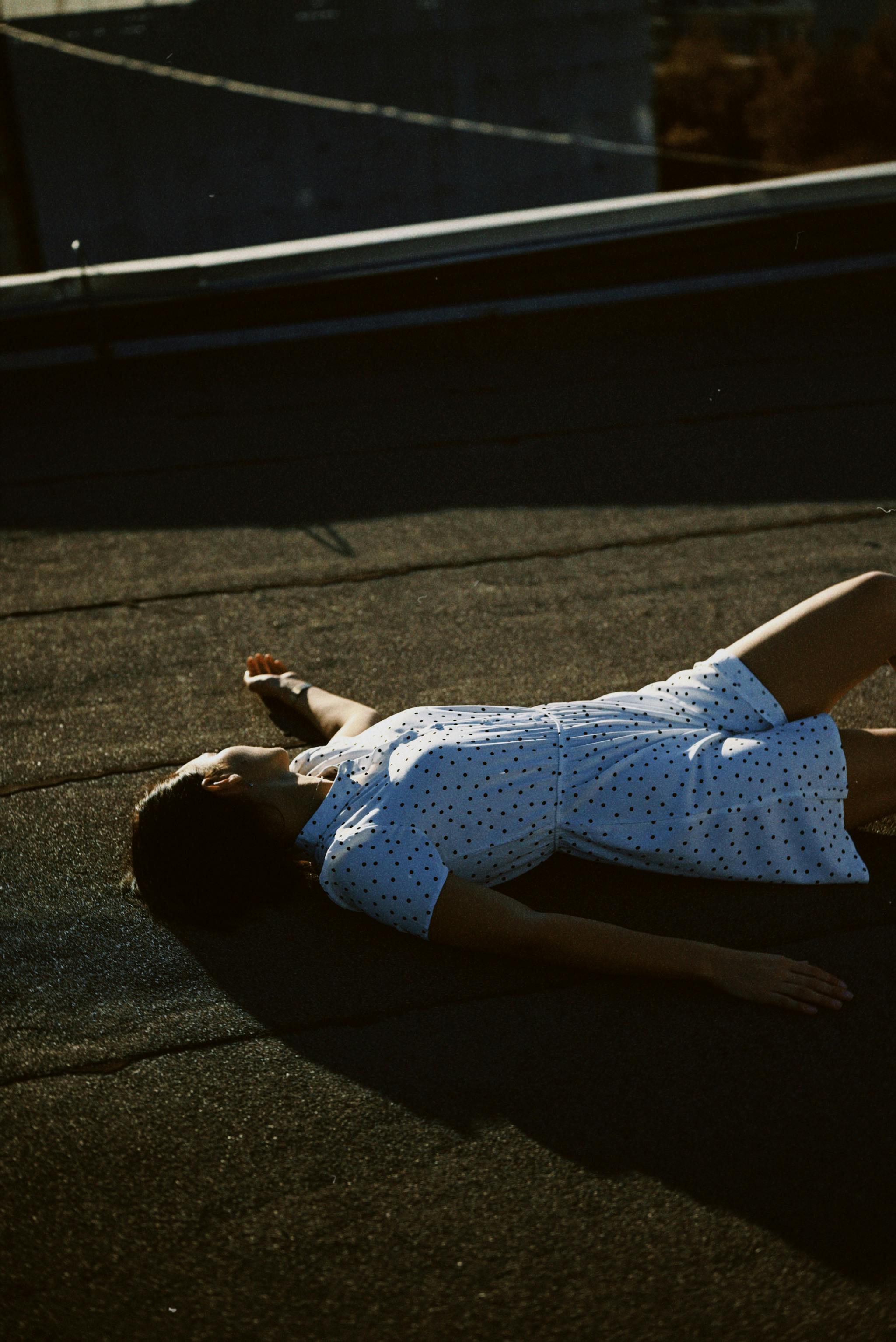 A Woman Lying Down on the Floor · Free Stock Photo