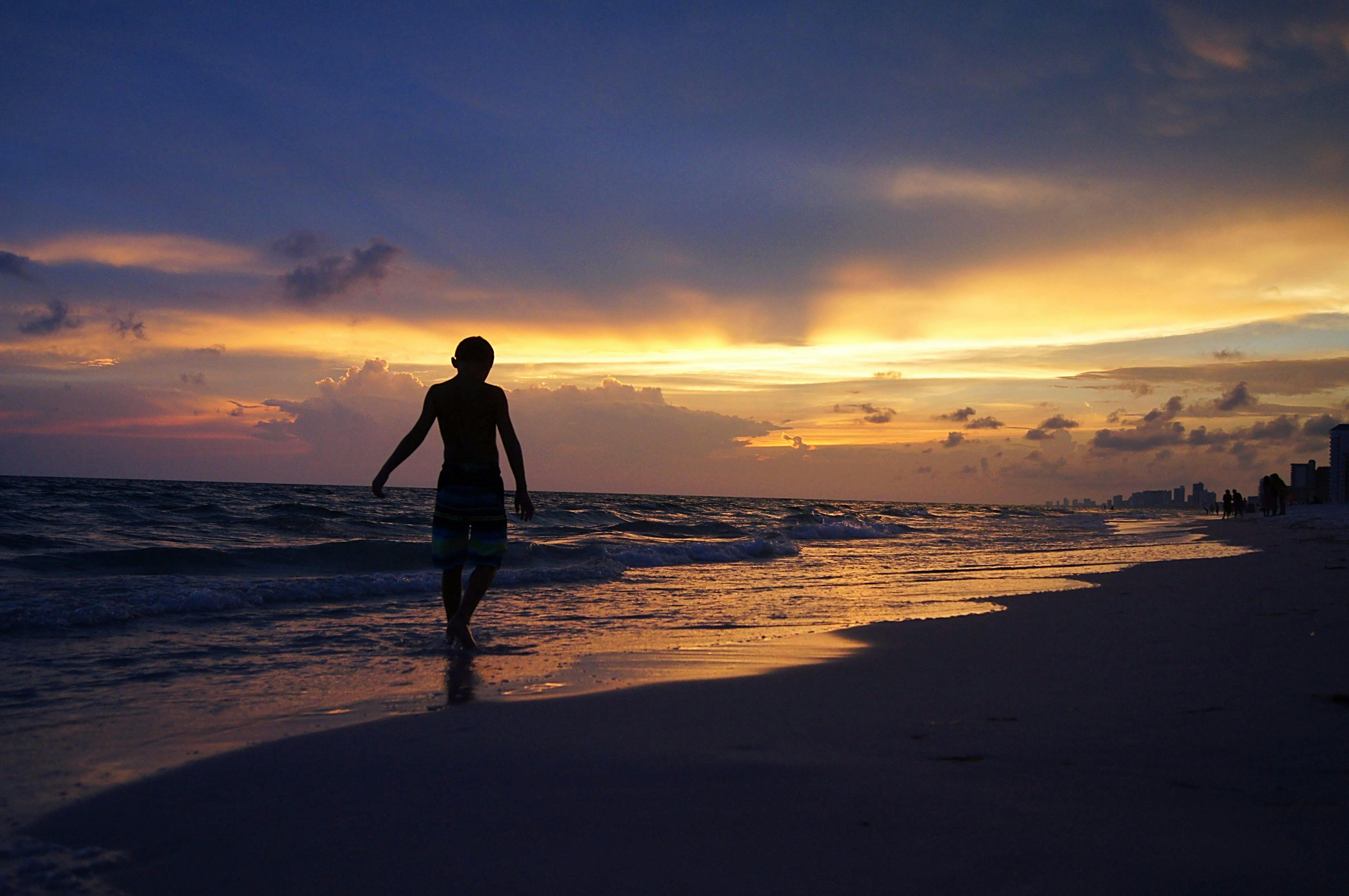 A Person Standing on the Beach · Free Stock Photo