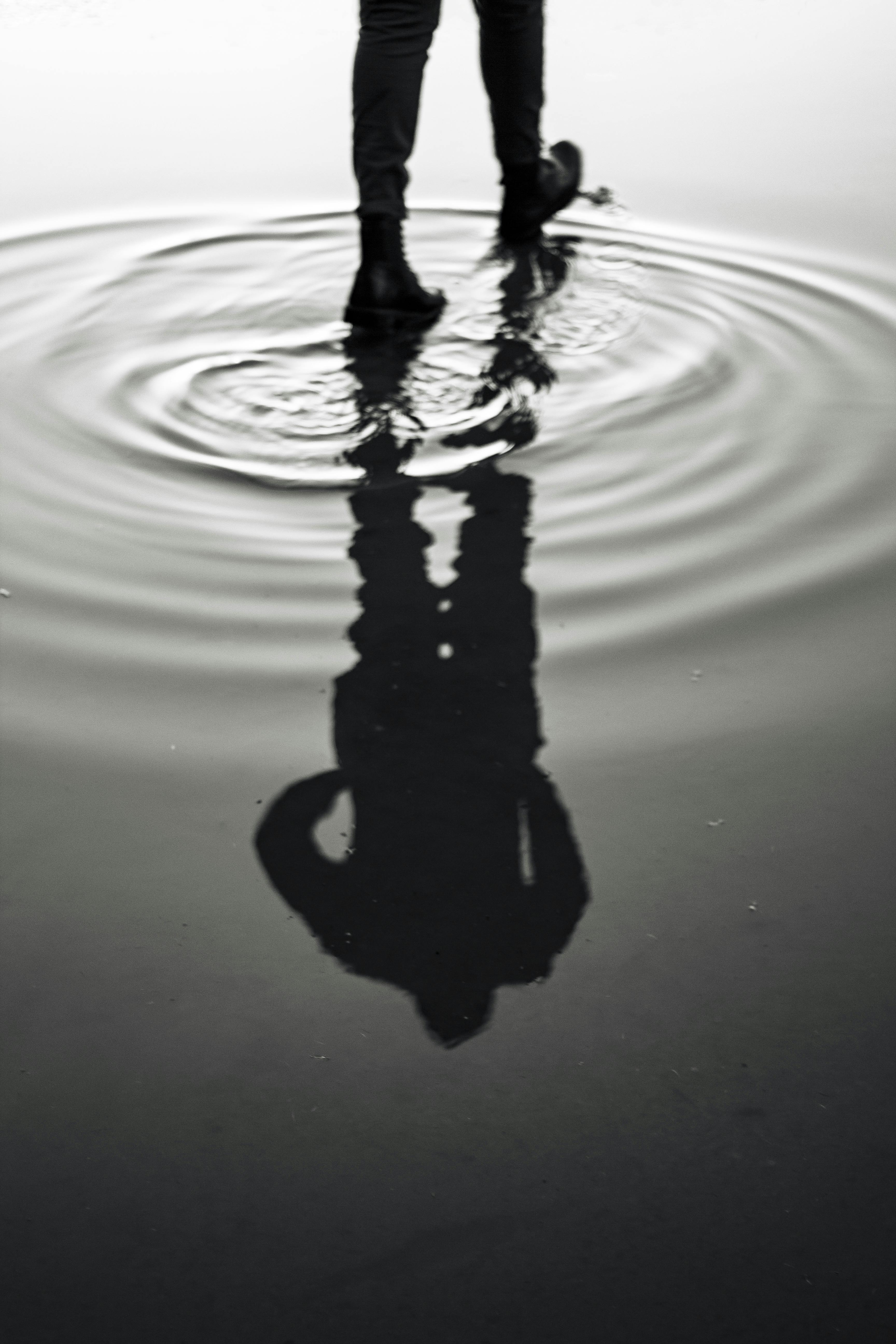 Reflection of Person Walking in Water · Free Stock Photo