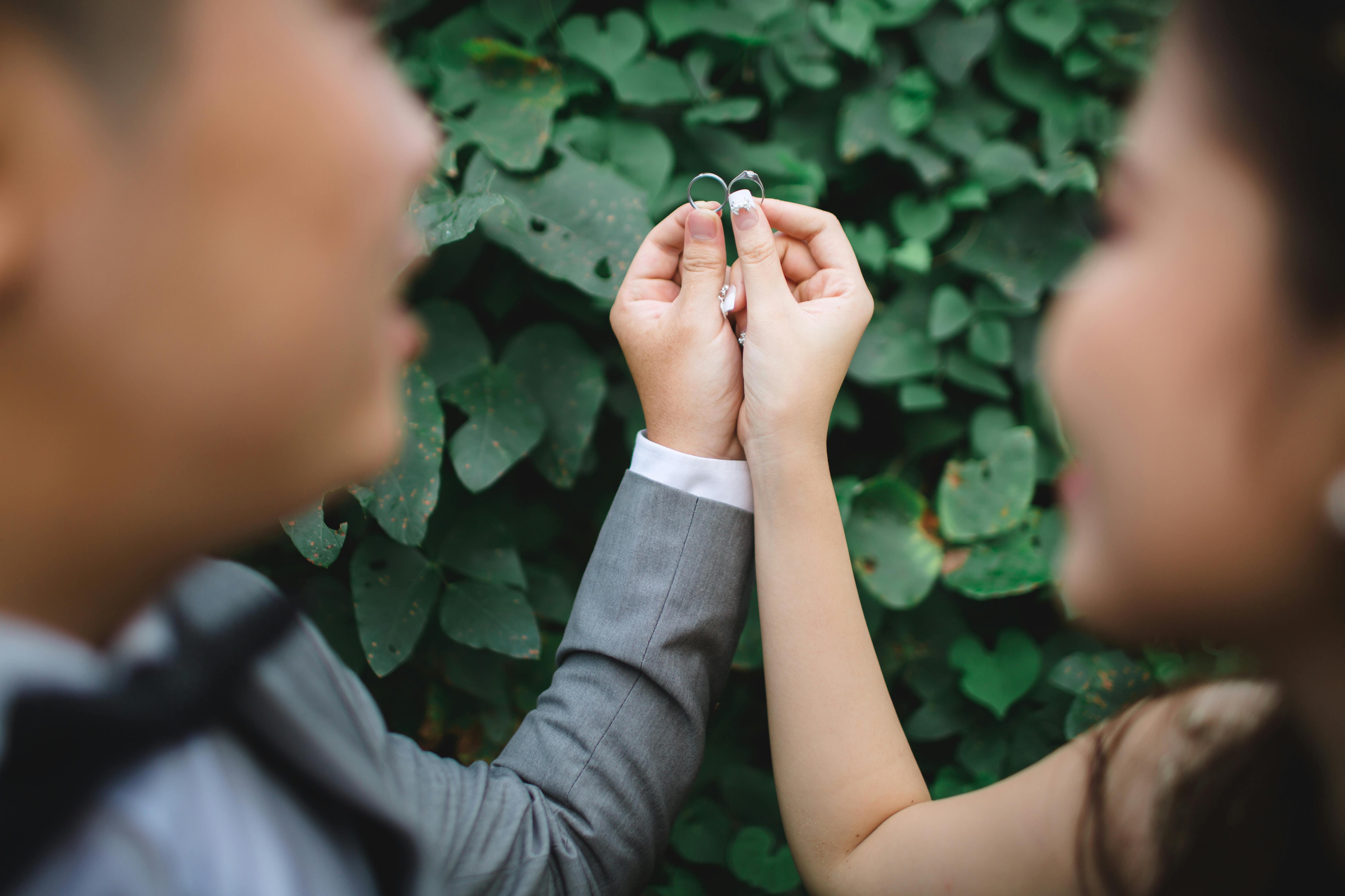 Photo of Hands Holding Rings · Free Stock Photo