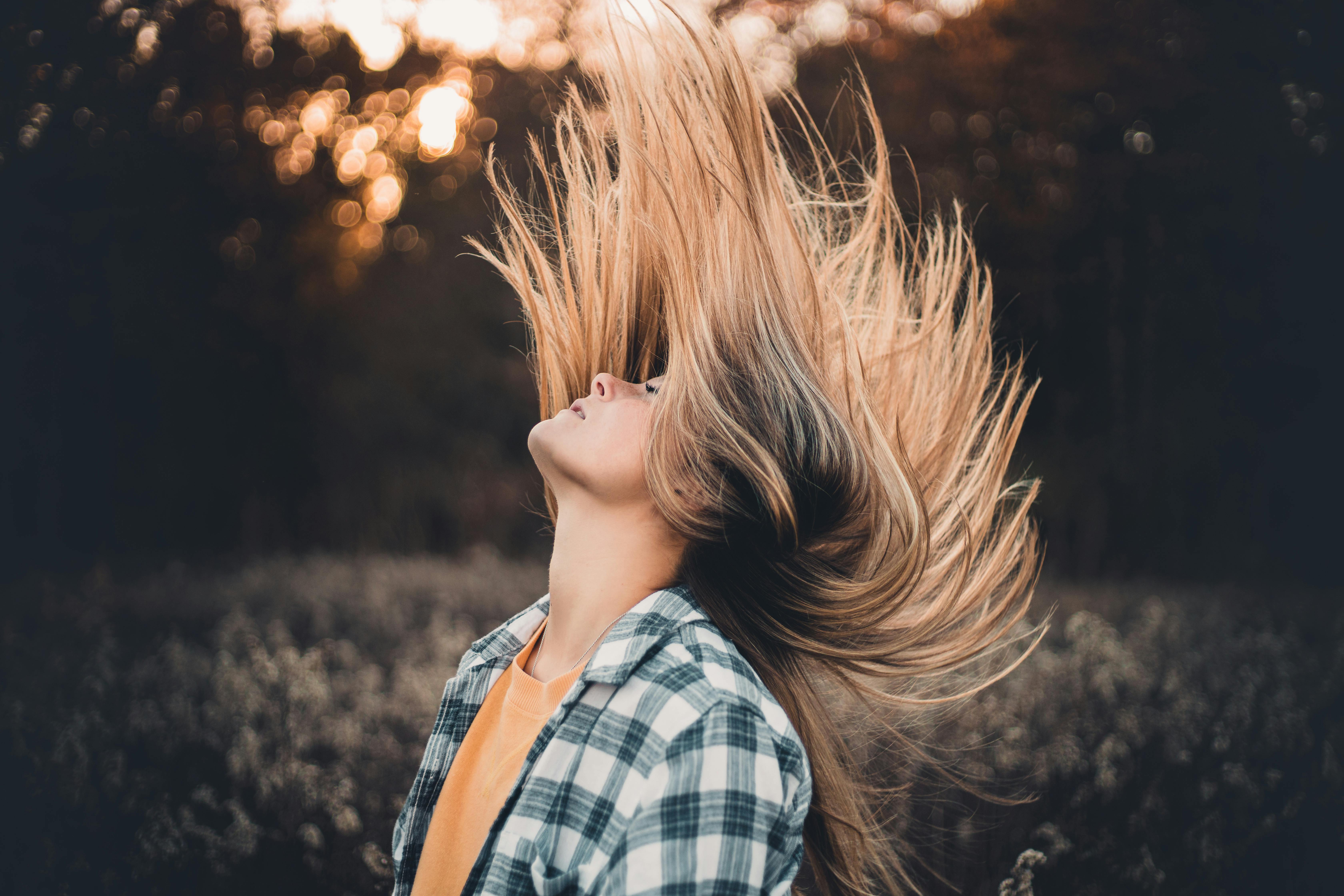 A Woman with Hair Flying in Air · Free Stock Photo