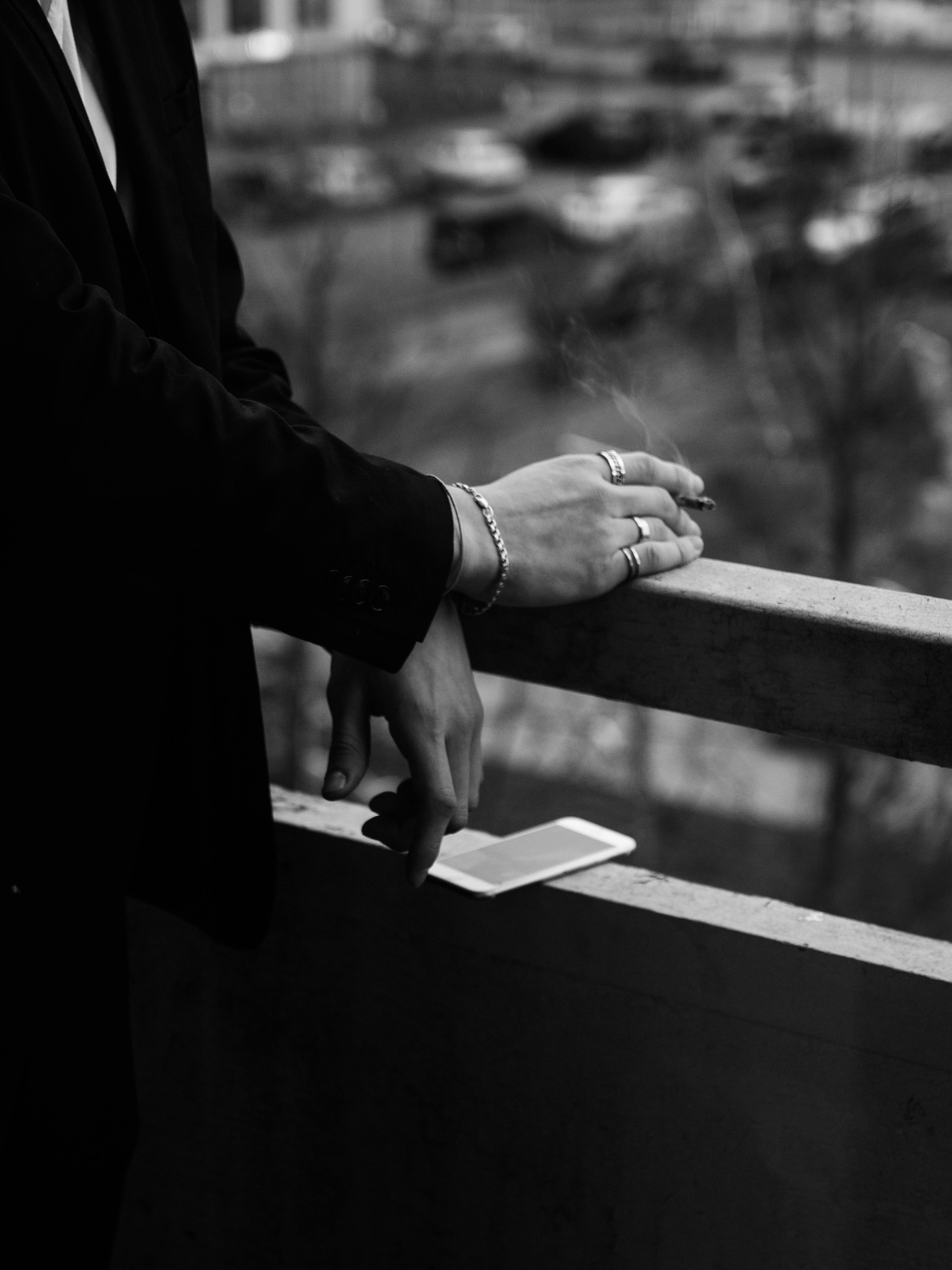 Person Holding a Railing · Free Stock Photo