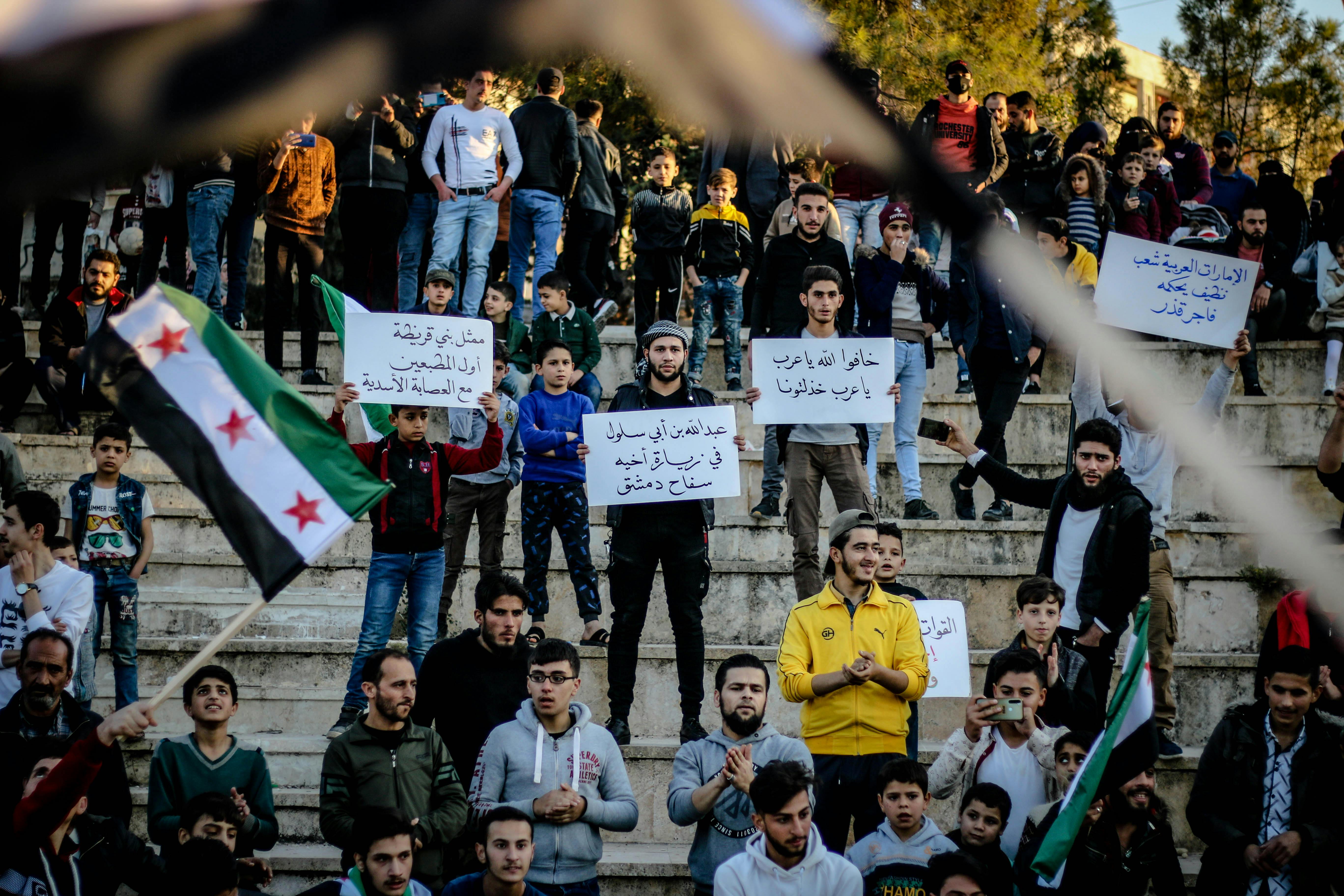 Boy Holding Political Placard about Gaza · Free Stock Photo
