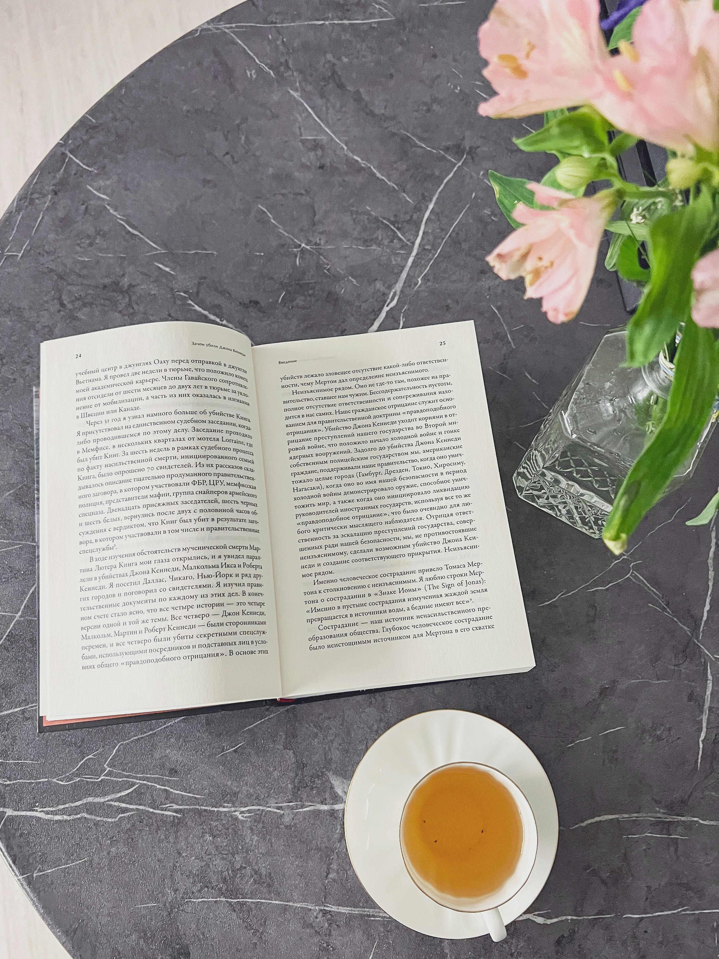 Woman Sitting on Carpet Behind a Marble Table Having Tea · Free Stock Photo