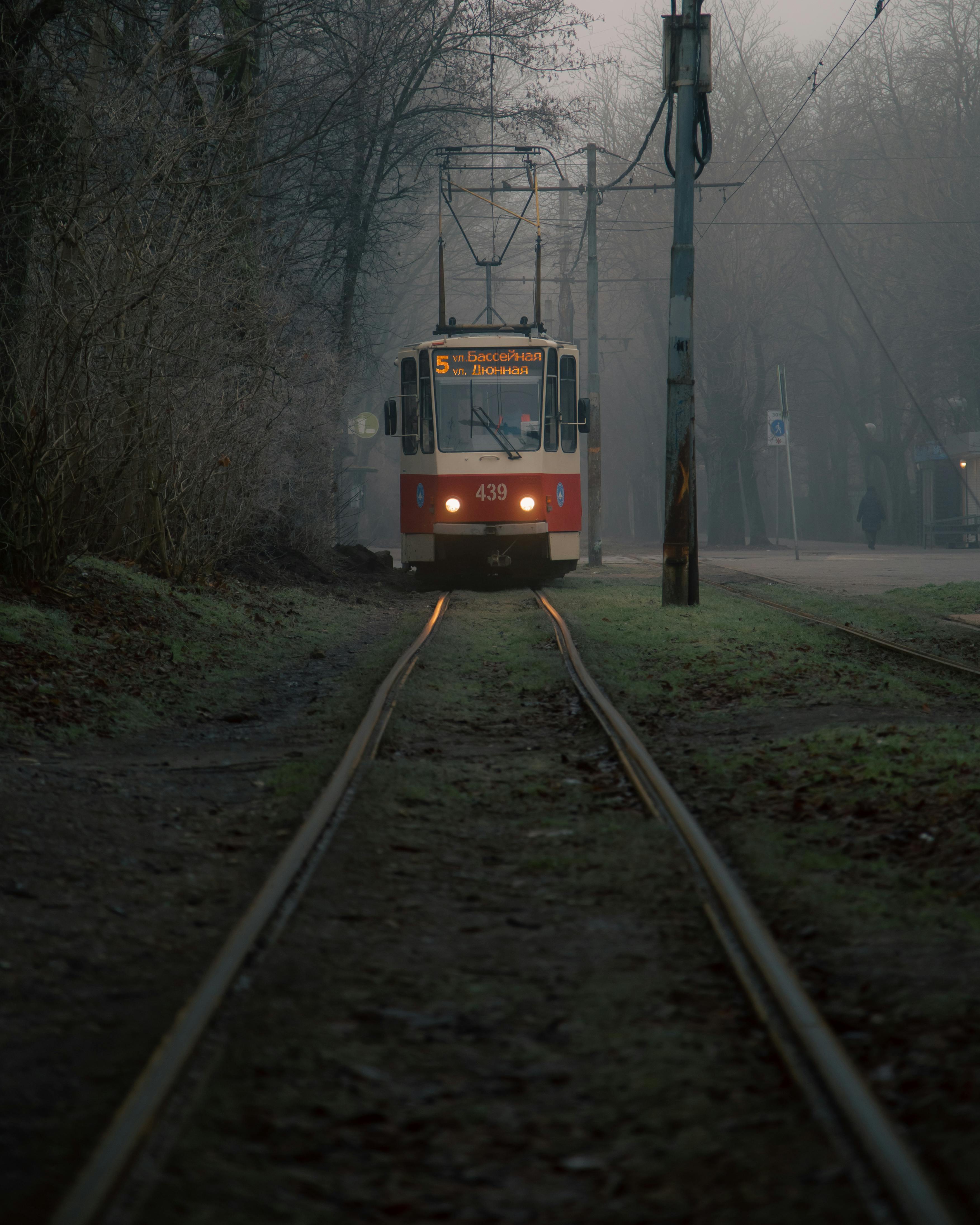 A Train Traveling on Rail Track · Free Stock Photo