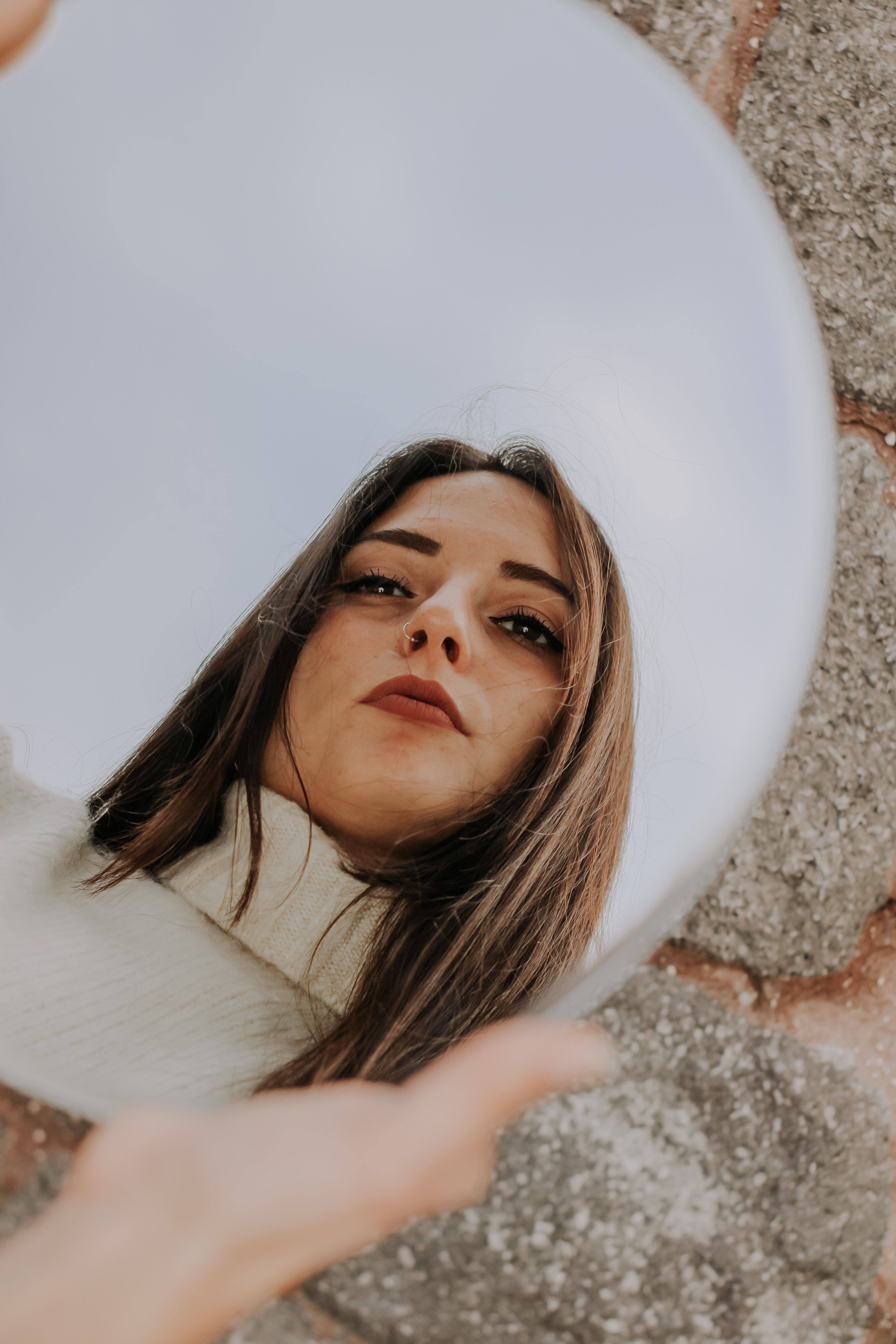 Person Holding a Round Mirror · Free Stock Photo