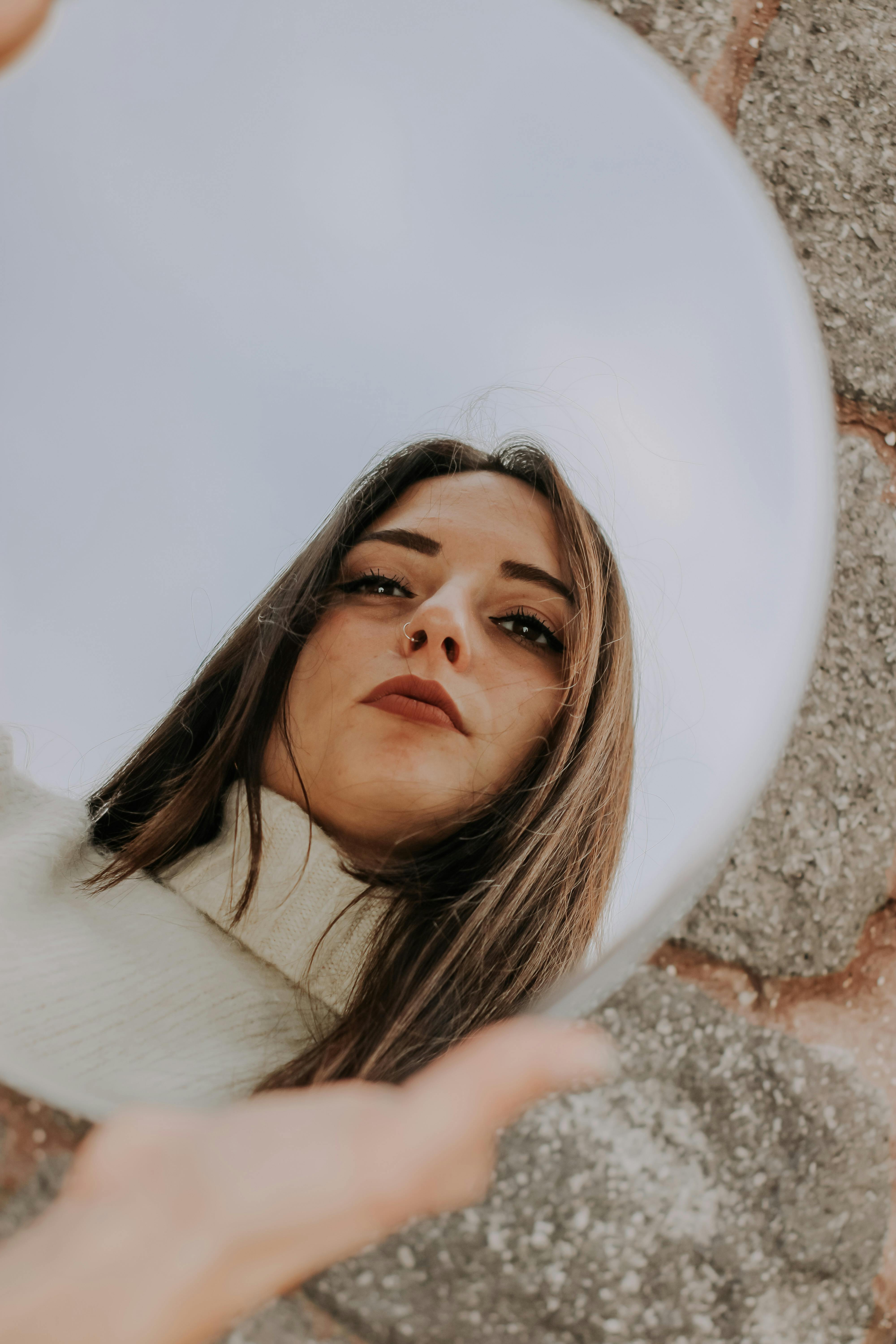 Person Holding a Round Mirror · Free Stock Photo