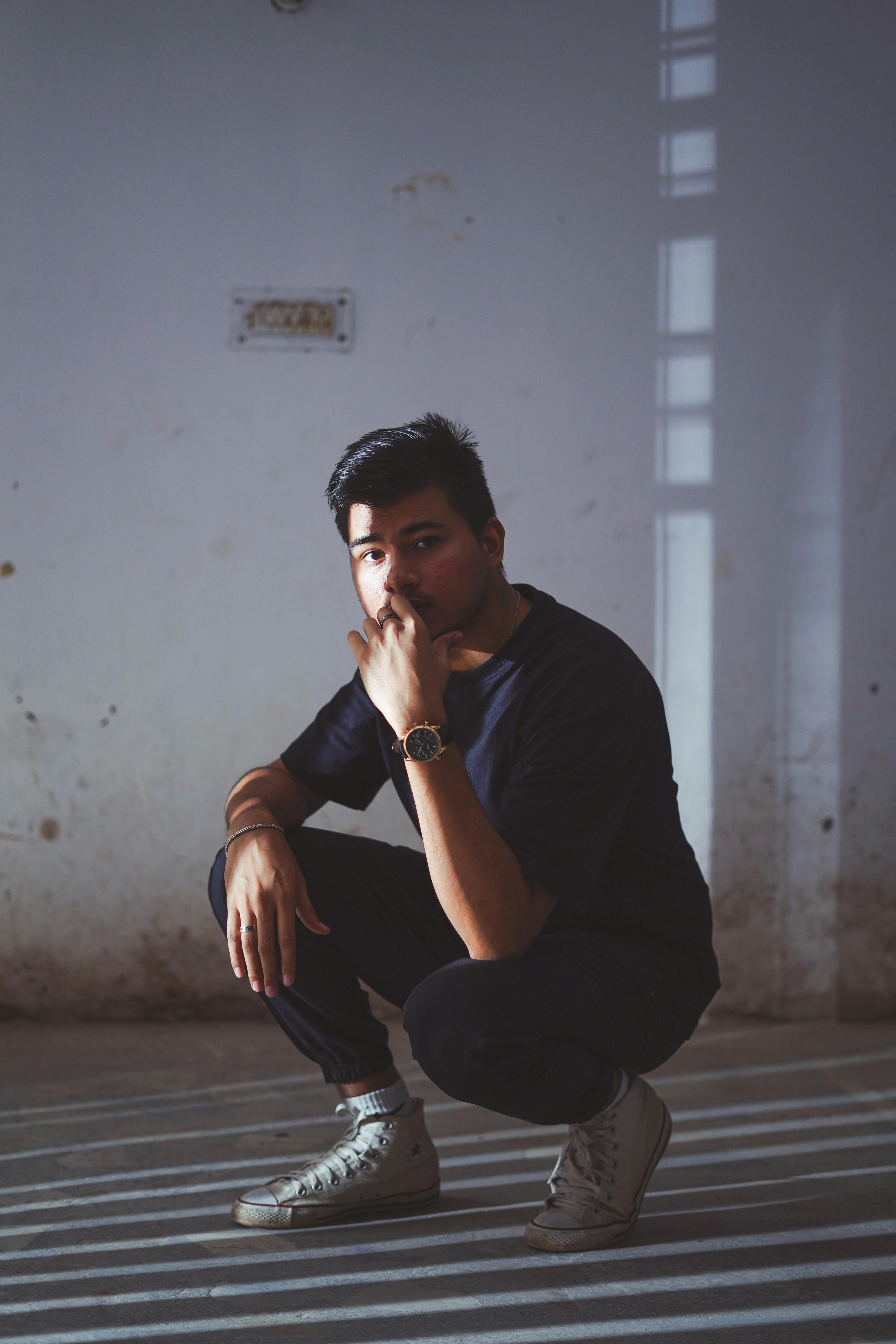 Person Holding White Wall · Free Stock Photo