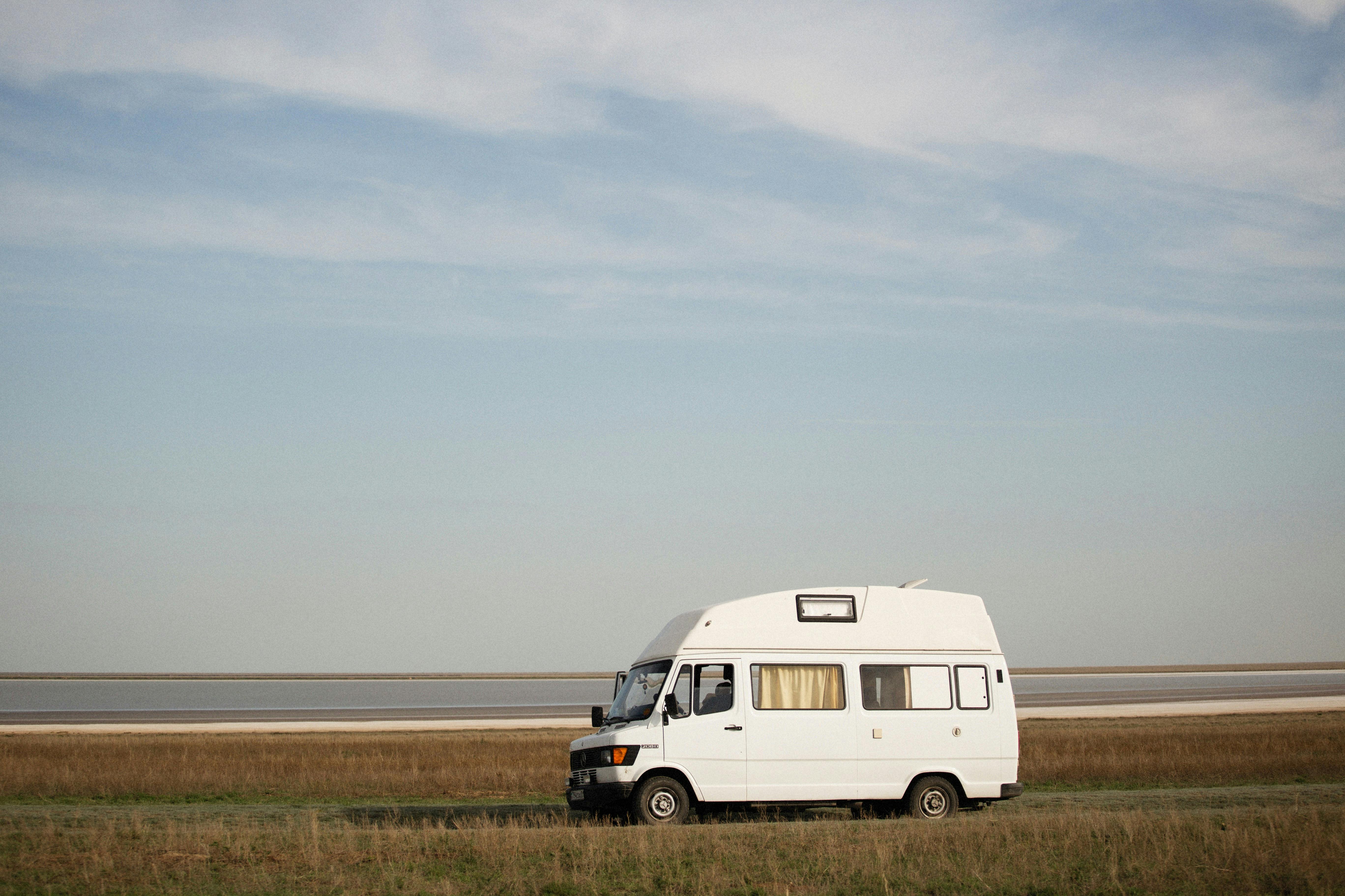 White Van on Grass Field · Free Stock Photo