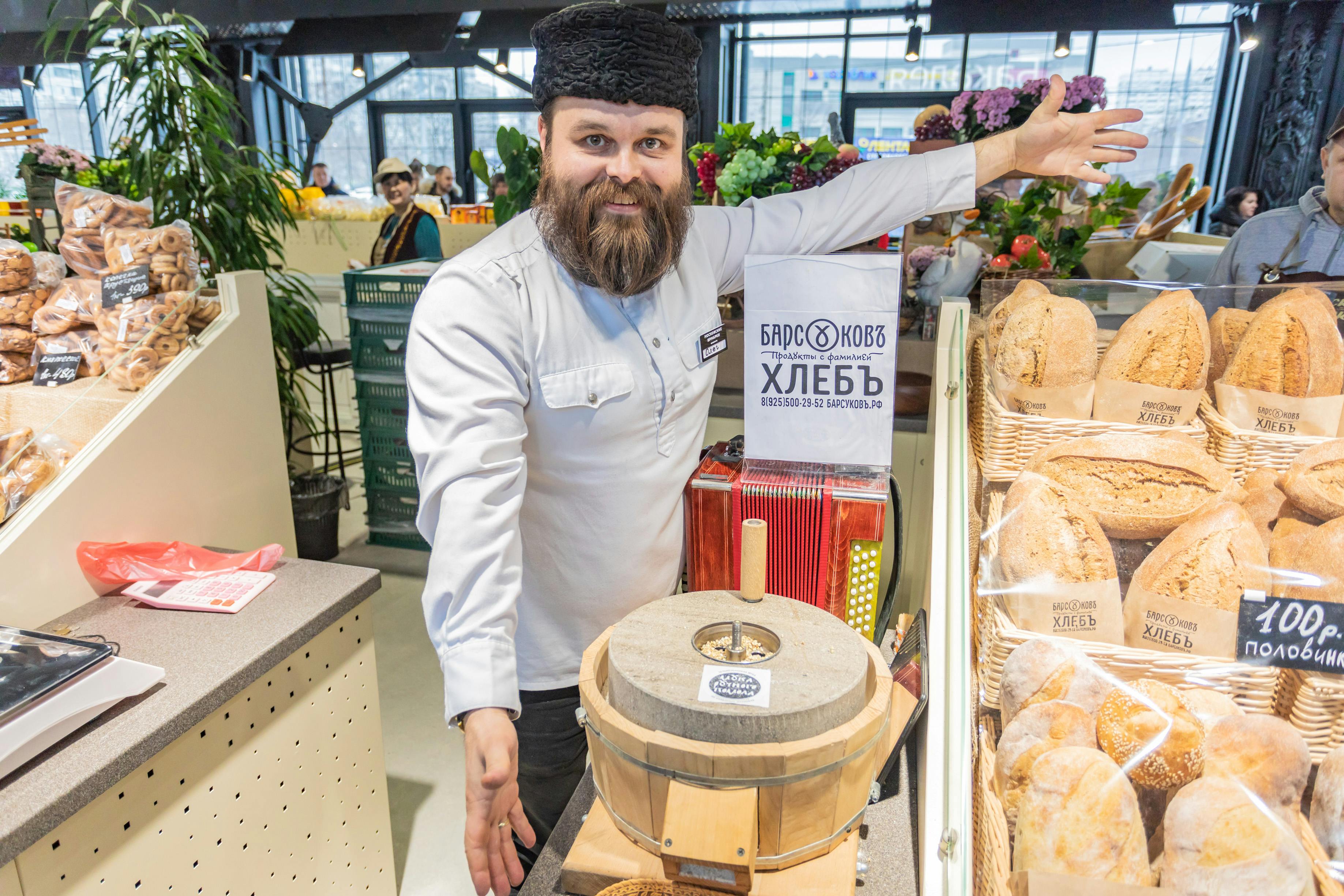 Bearded Man Working in a Bakery Standing and Showing the Bread · Free ...