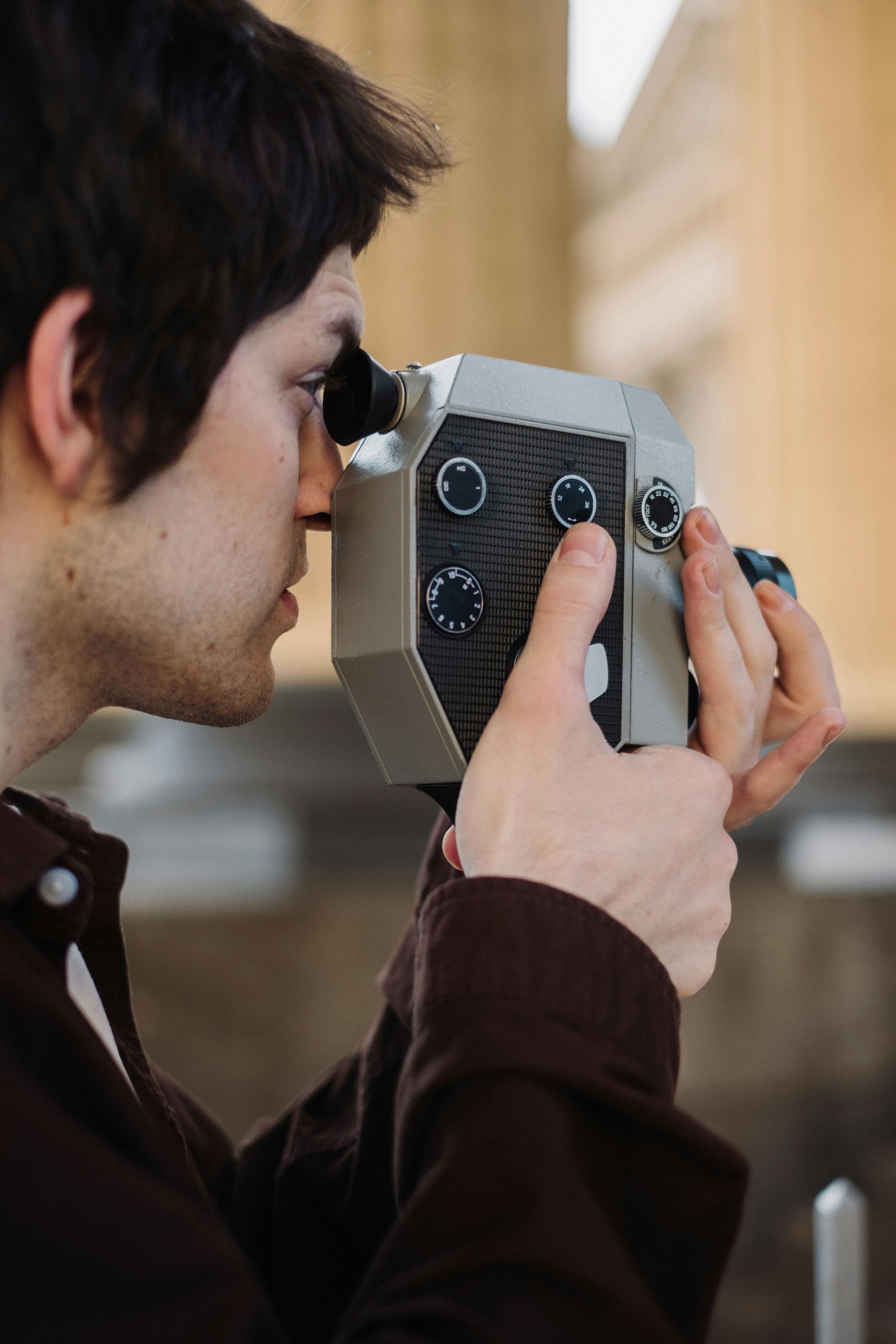 Man Filming with Analog Camera · Free Stock Photo