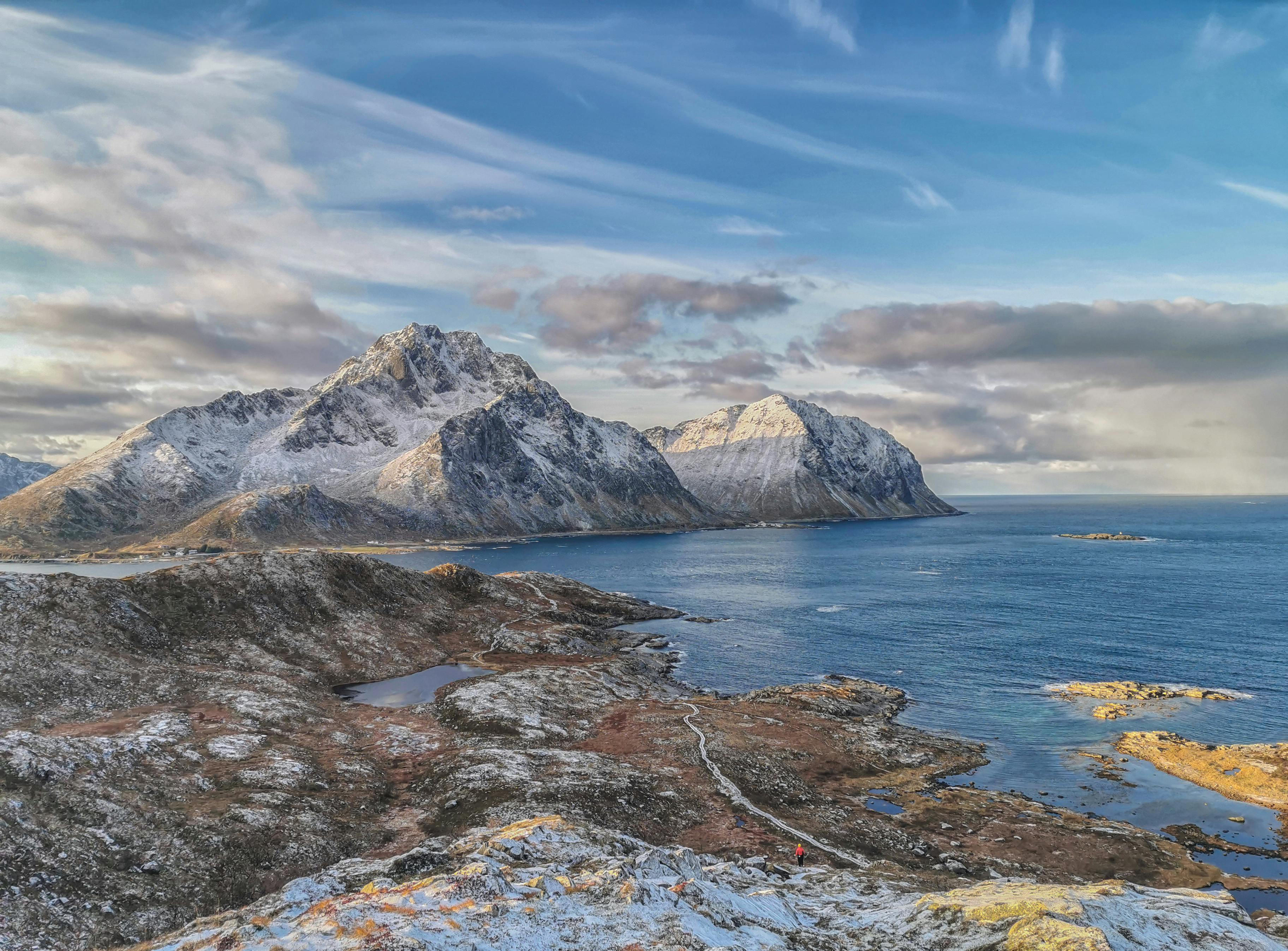 Snowy Mountains Over the Sea · Free Stock Photo