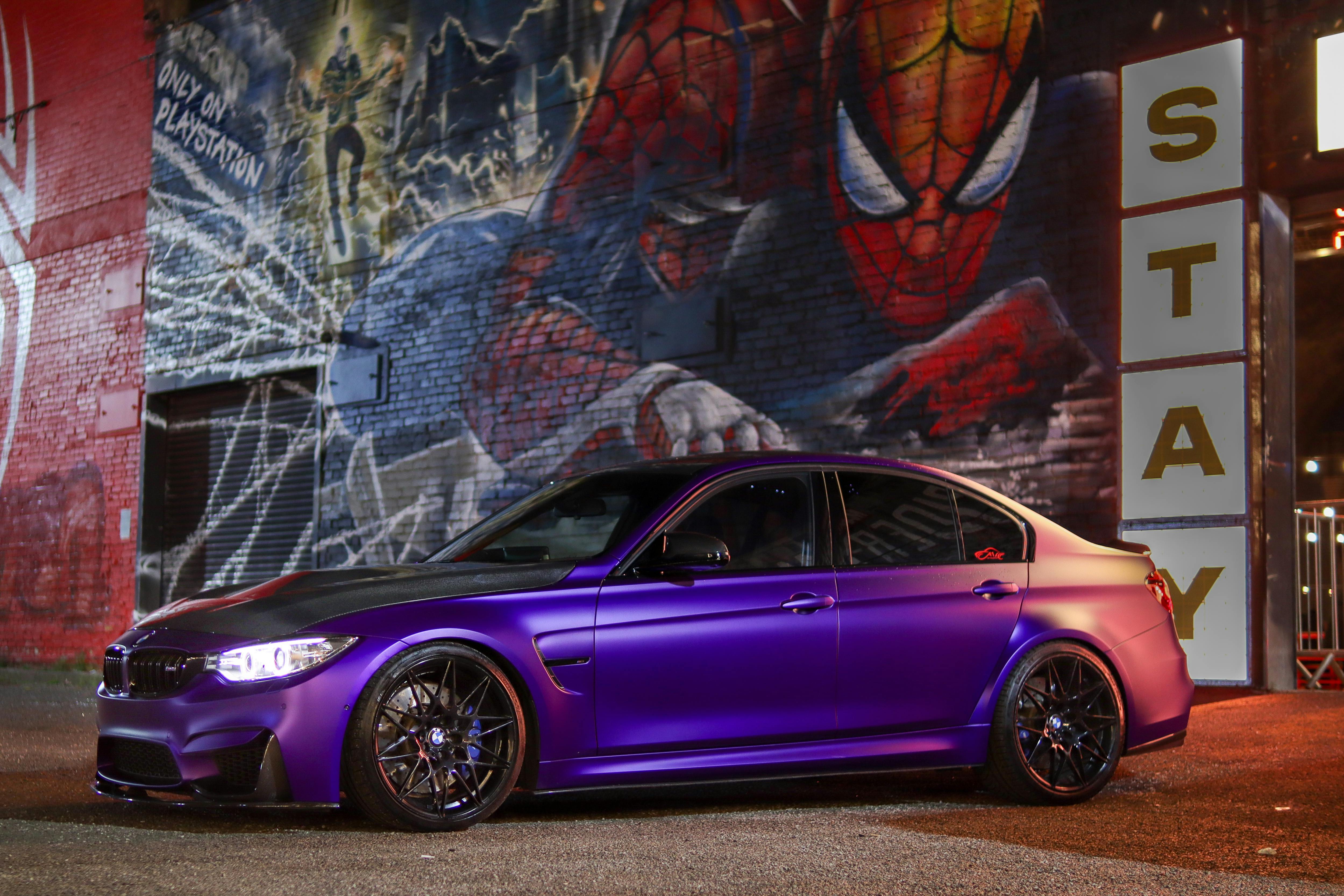 Parked Purple BMW M3 Car in front of a Mural · Free Stock Photo