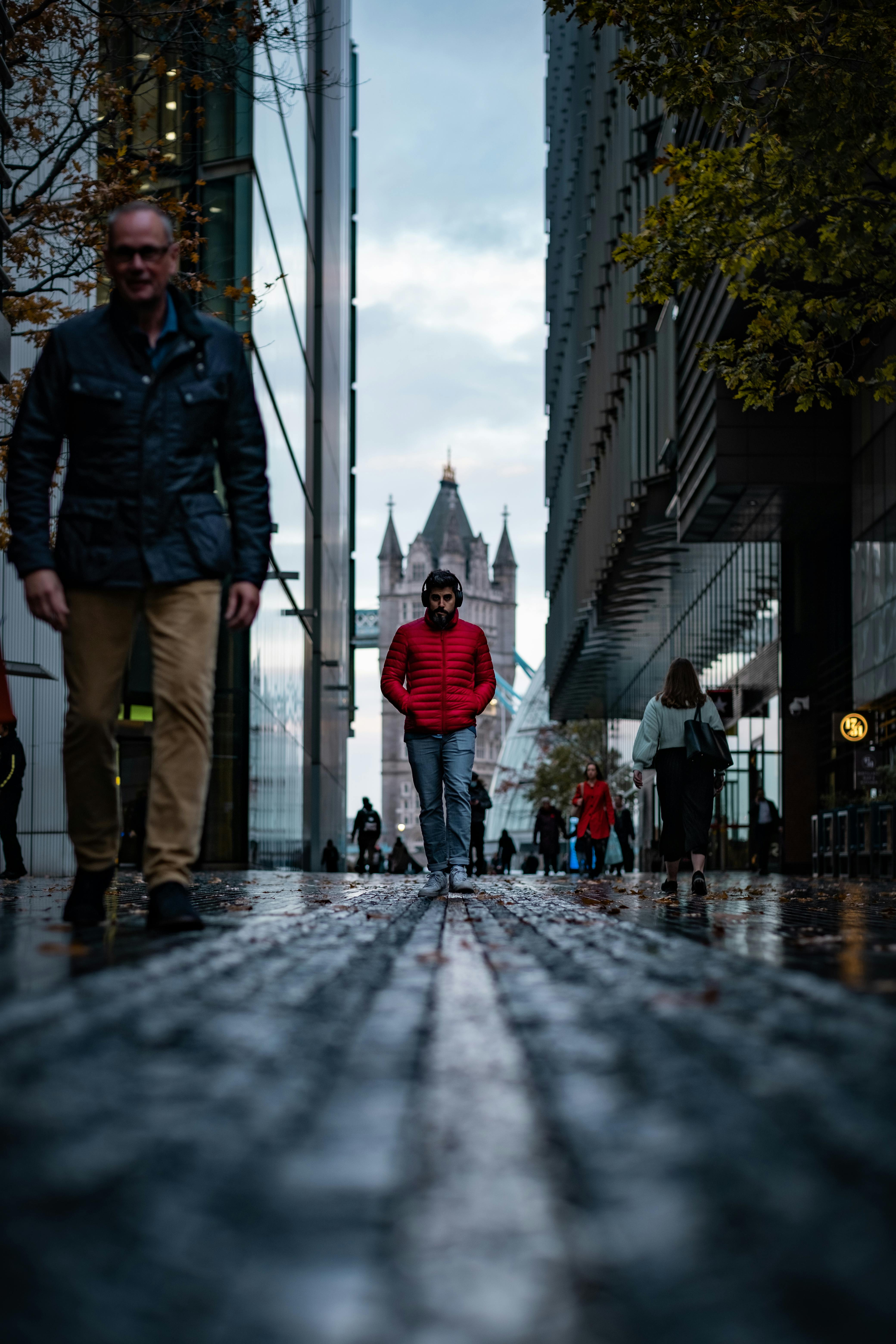 Photo of a People Walking on a Sidewalk in a City · Free Stock Photo