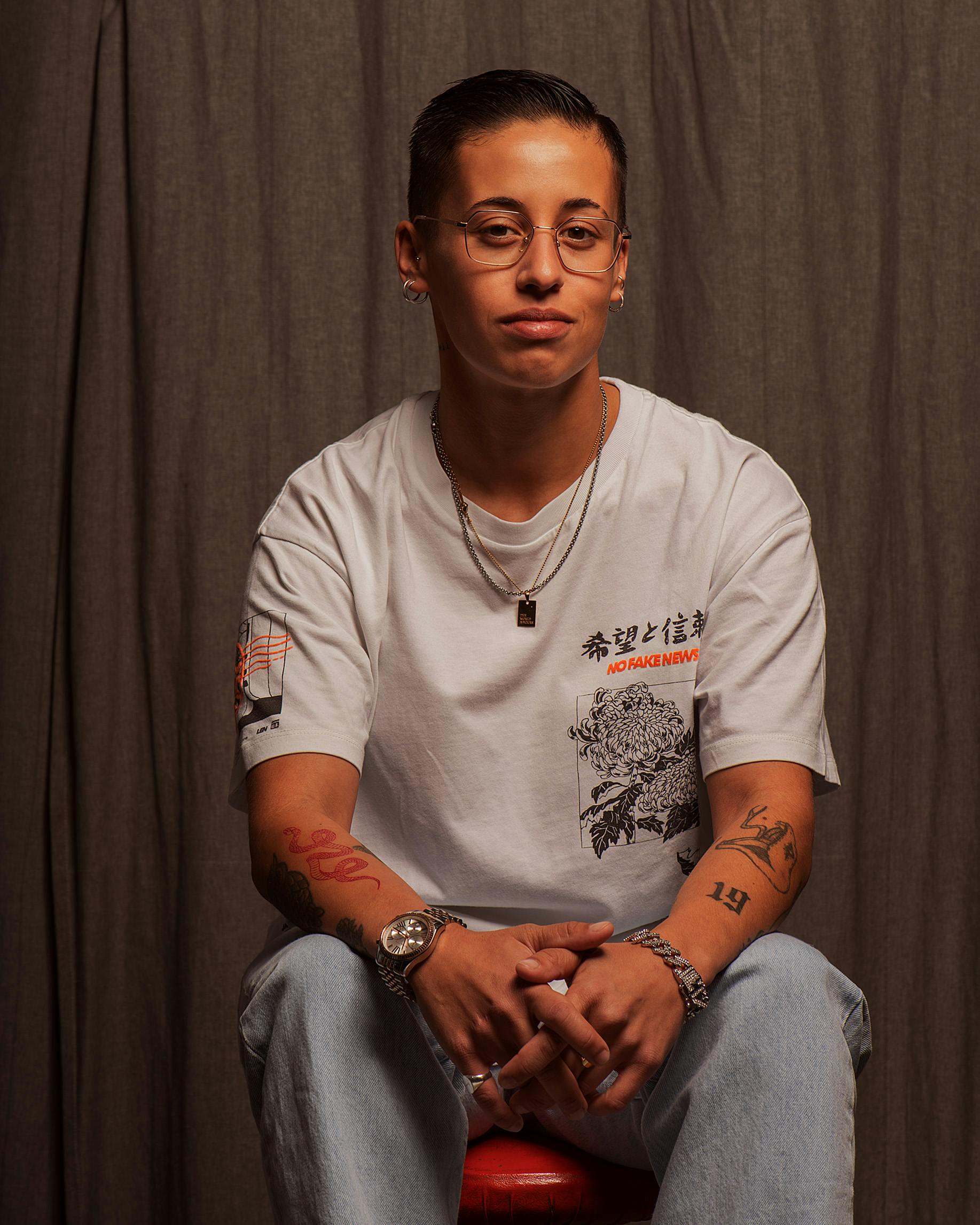 ChairA Man in White Crew Neck T-shirt and Blue Denim Jeans Sitting on a ...