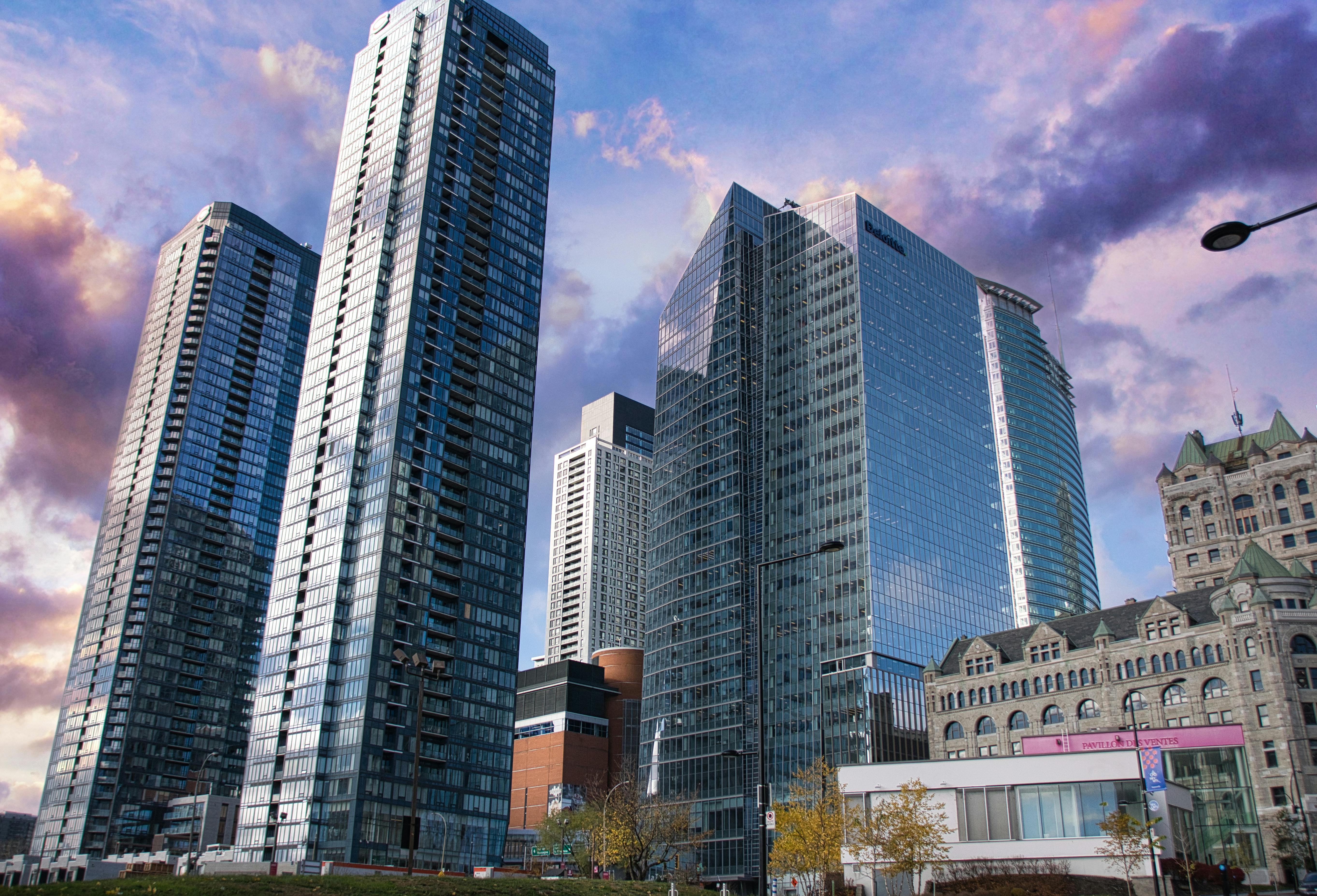 Cloudy Sky Over Skyscrapers · Free Stock Photo