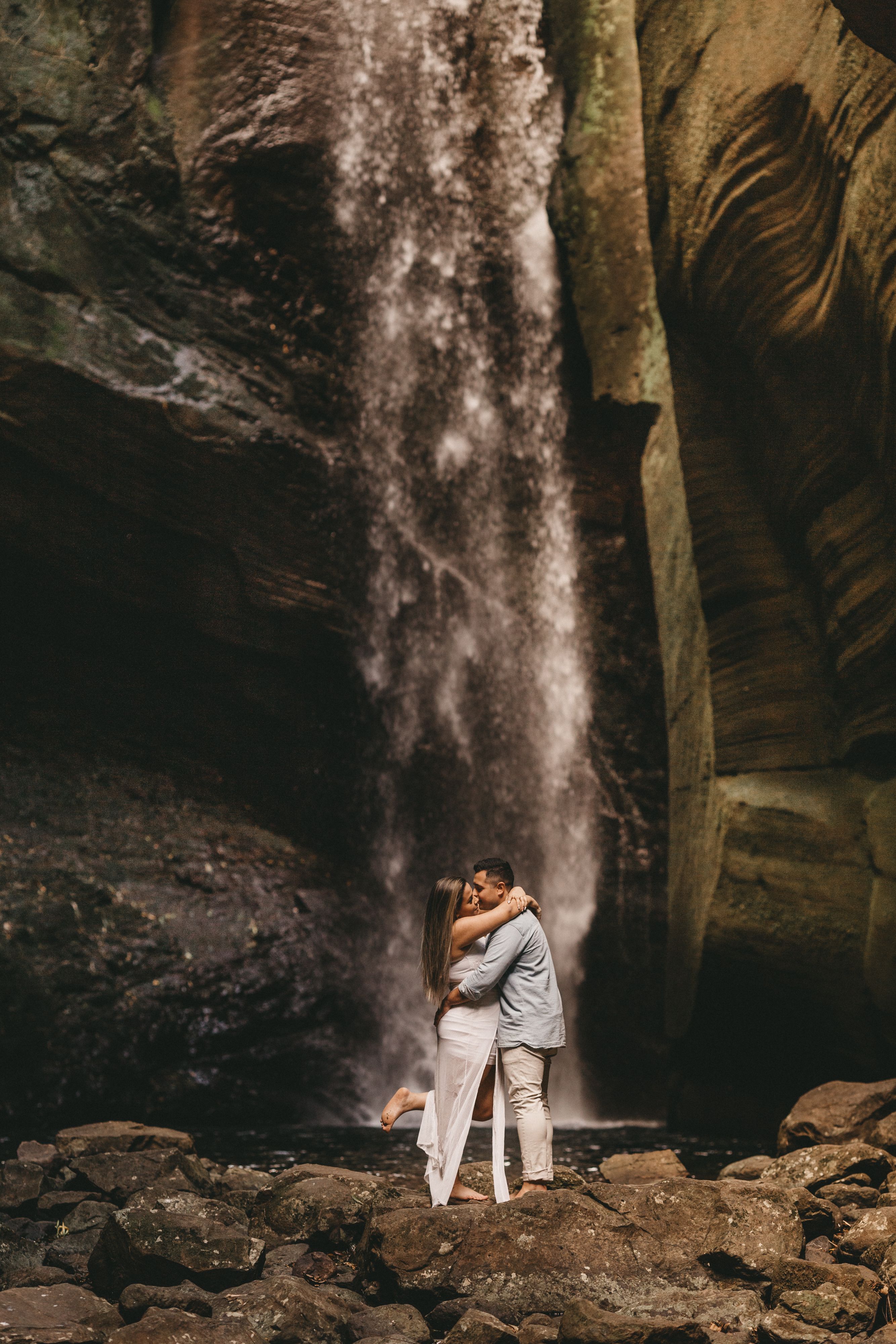 A Couple Kissing under a Waterfall · Free Stock Photo