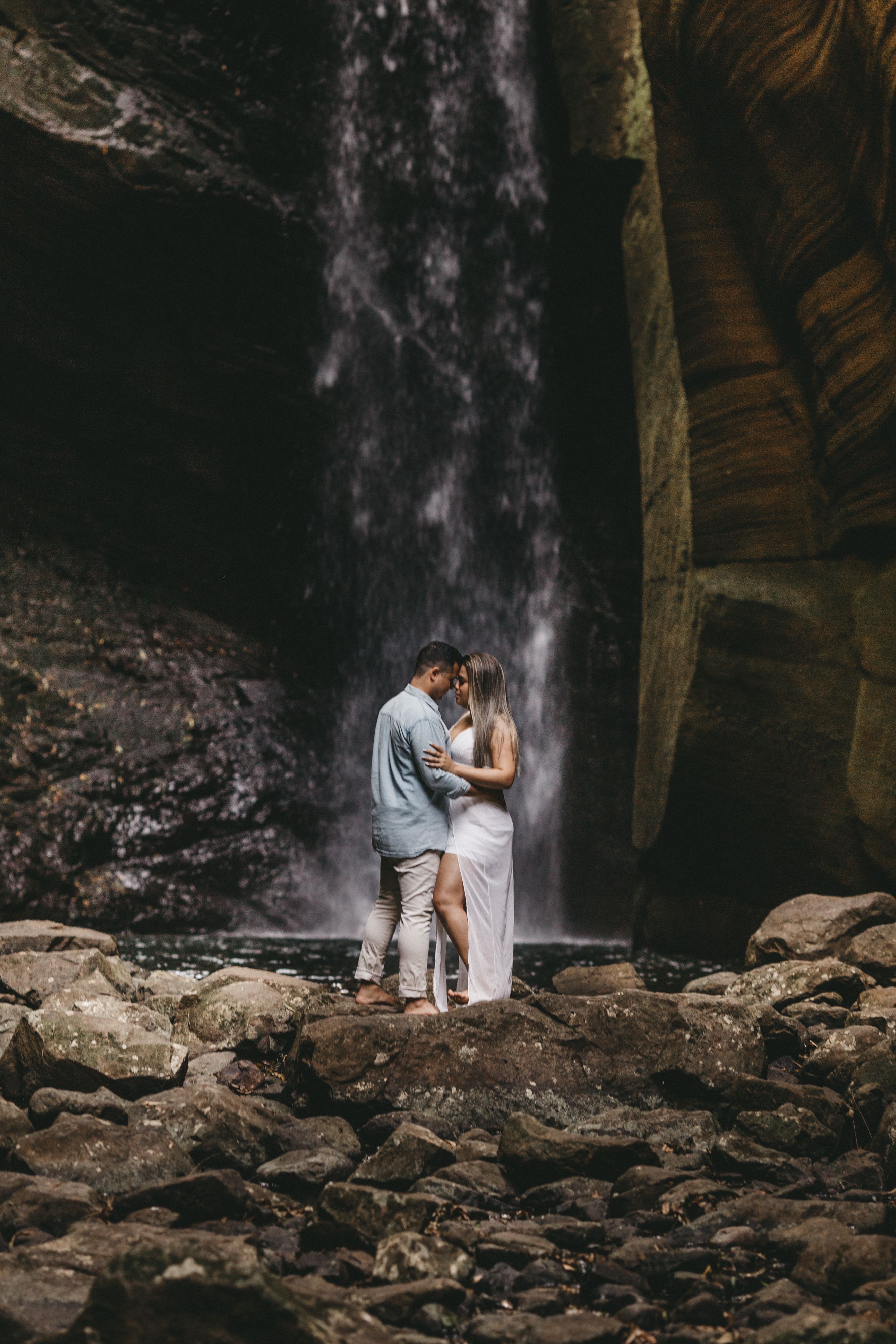 A Couple Kissing under a Waterfall · Free Stock Photo