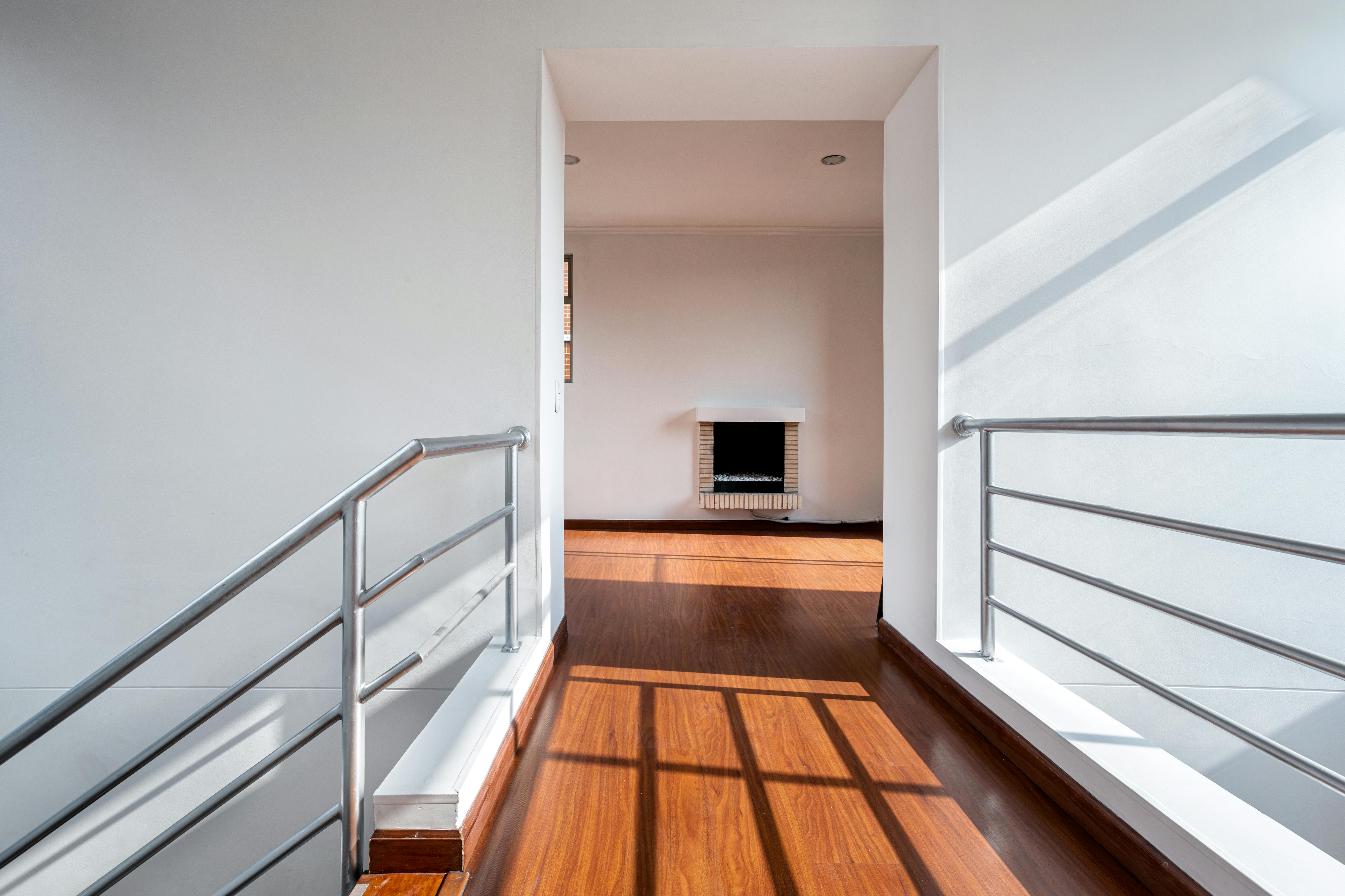 Railing Surrounding the Hallway in an Apartment · Free Stock Photo